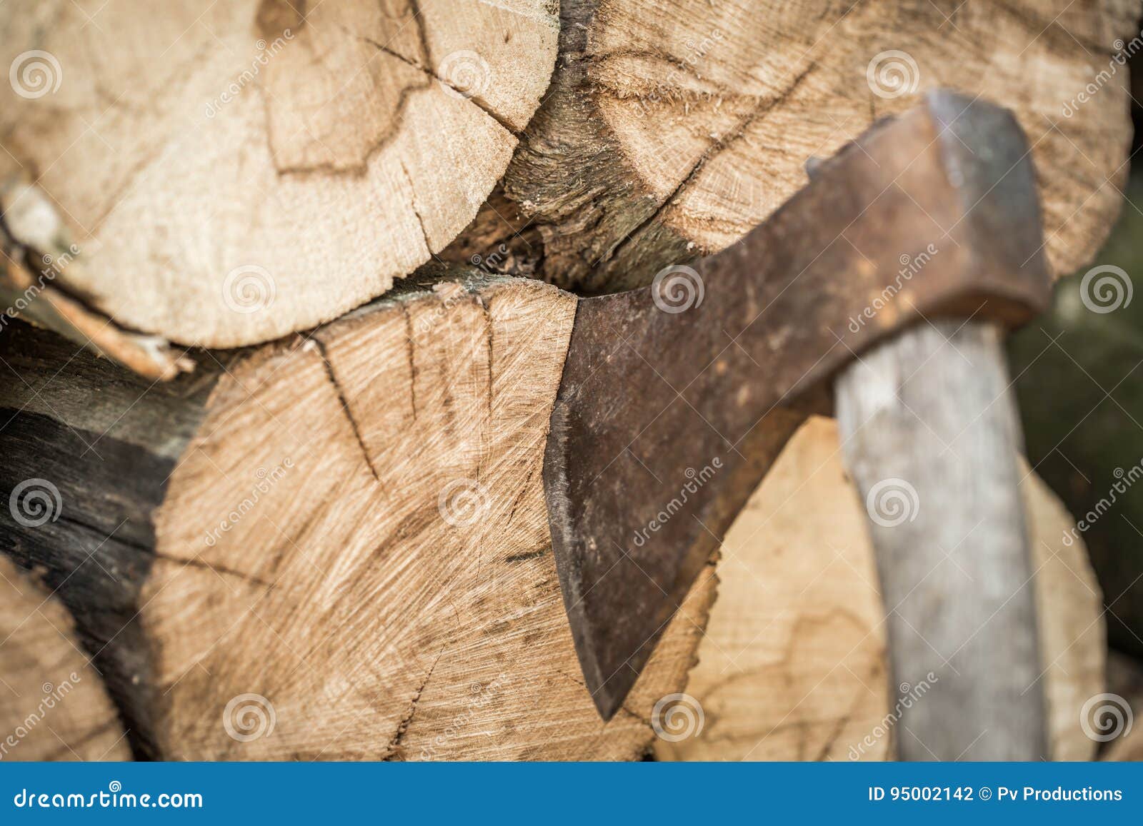 A Deck of Stacked Logs and an Axe Stock Photo - Image of outdoors ...