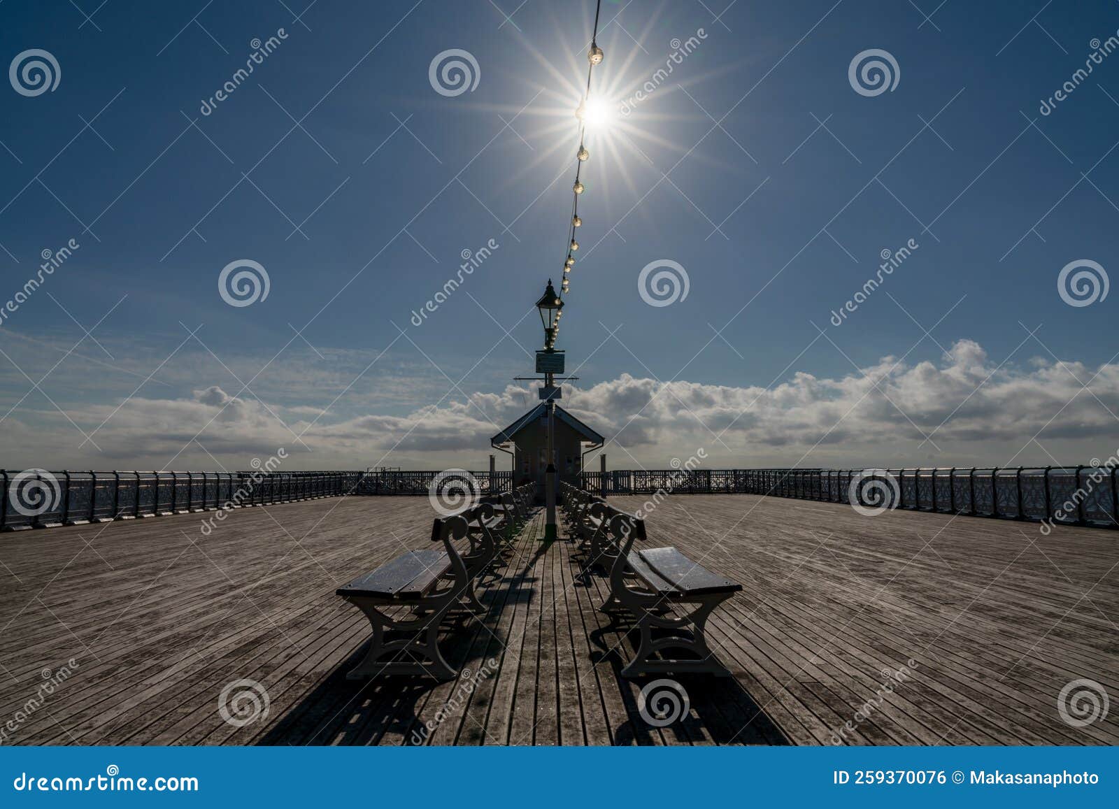 The Deck of the Victorian Pier in Penarth with a Sunburst Stock Photo ...