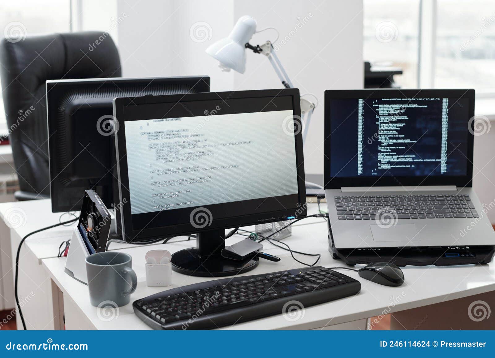 Decoded Data on Computer and Laptop Screens Standing on Workplace of ...