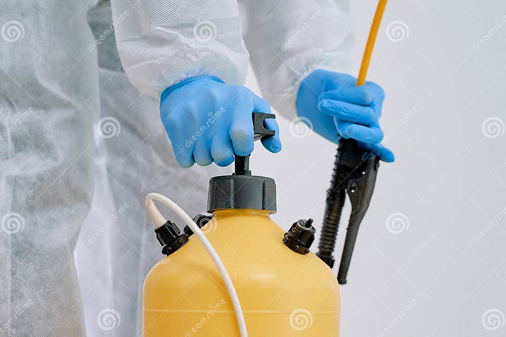 Decontamination Service Worker Using a Container of Disinfectant. Stock ...