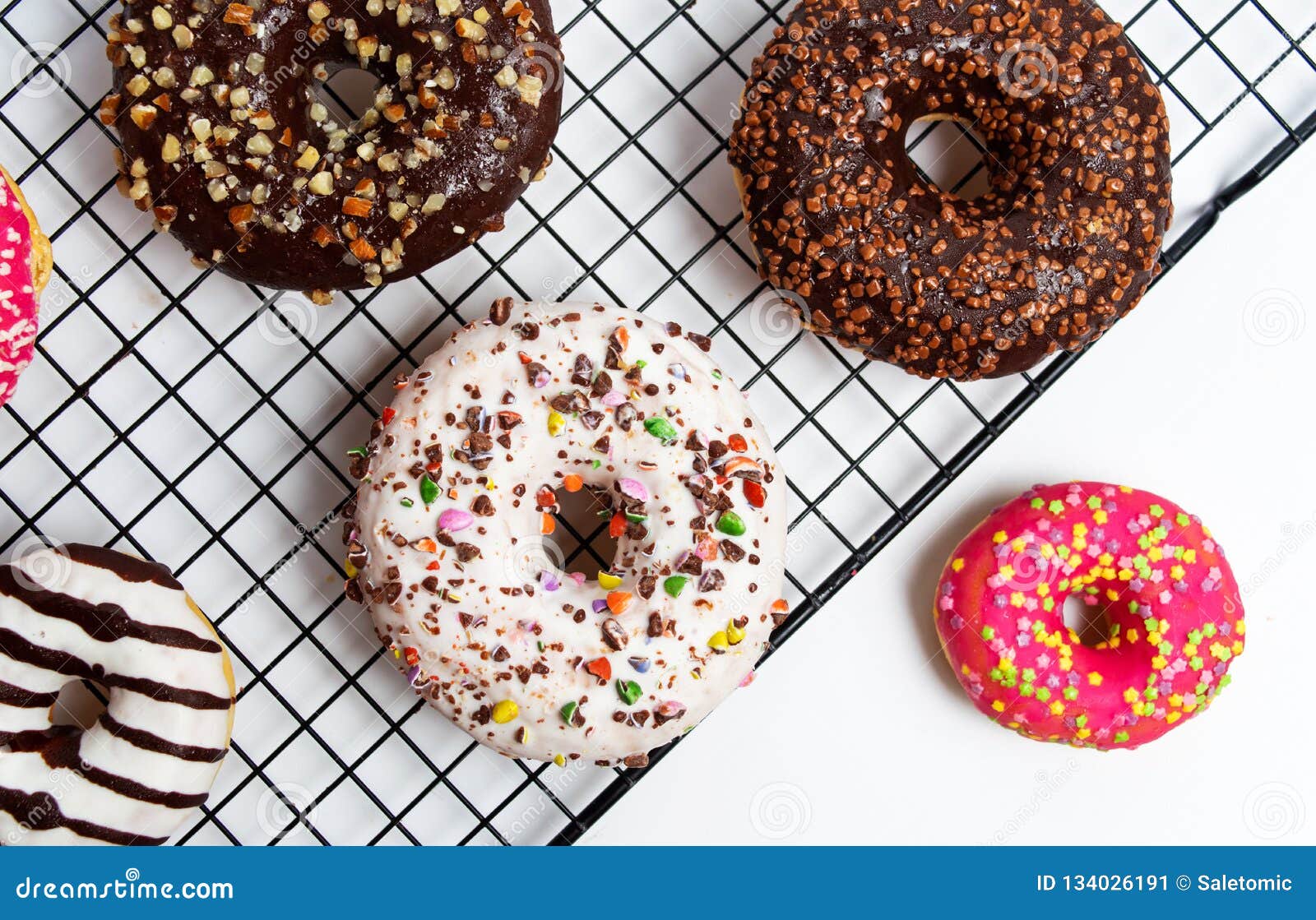 Decorated Chocolate Donuts on a Baking Grid Stock Image - Image of ...