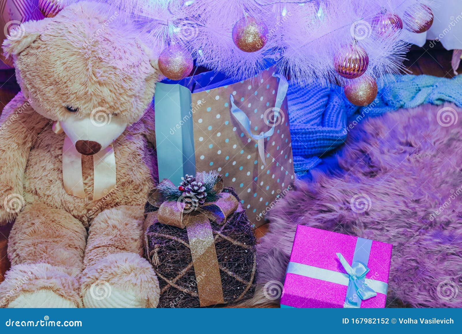 Decorated Christmas Tree with Gift Under it and Teddy Bear Stock Photo ...