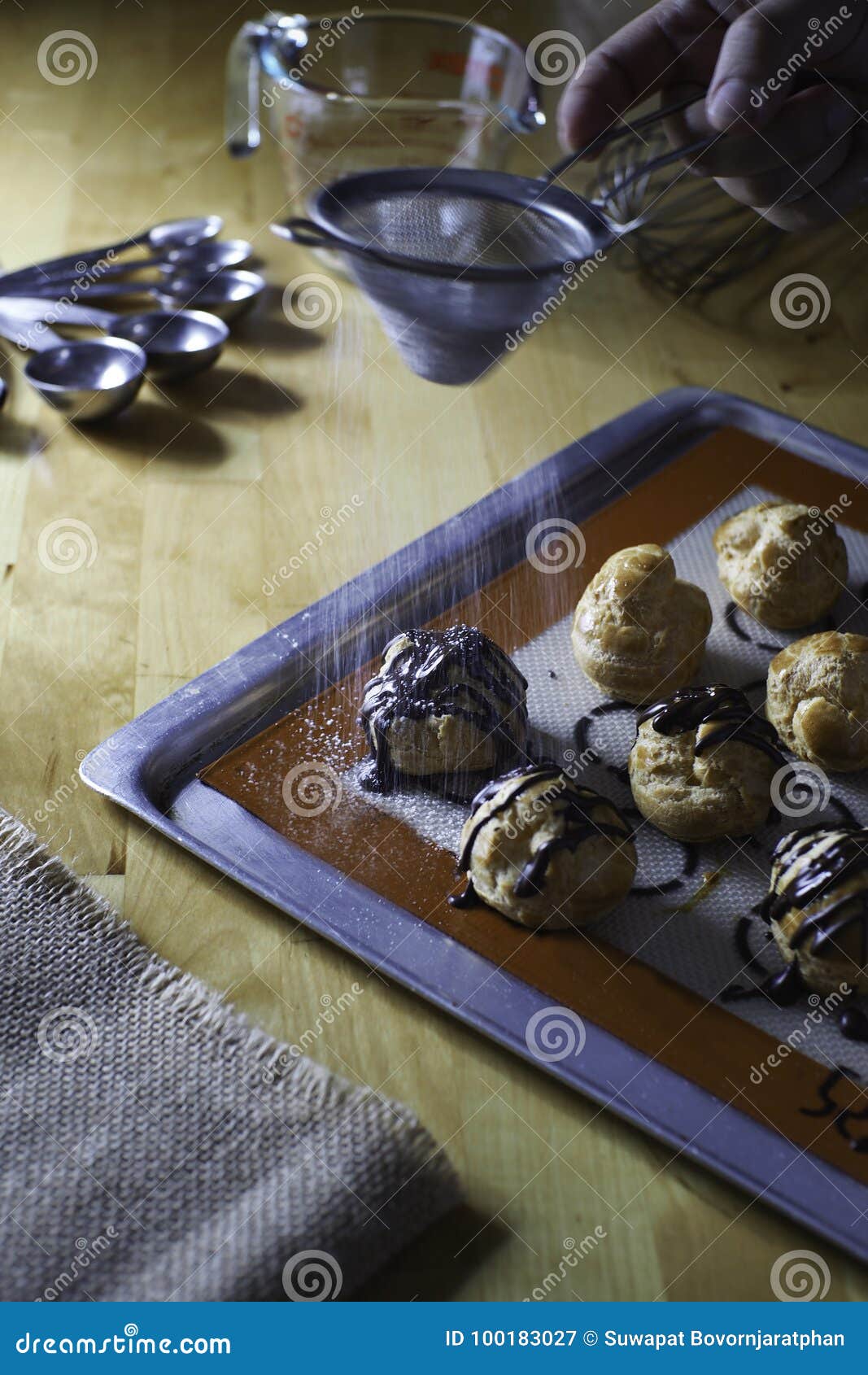 Decorating Choux Ceam with Icing Sugar. Stock Image - Image of delicios ...