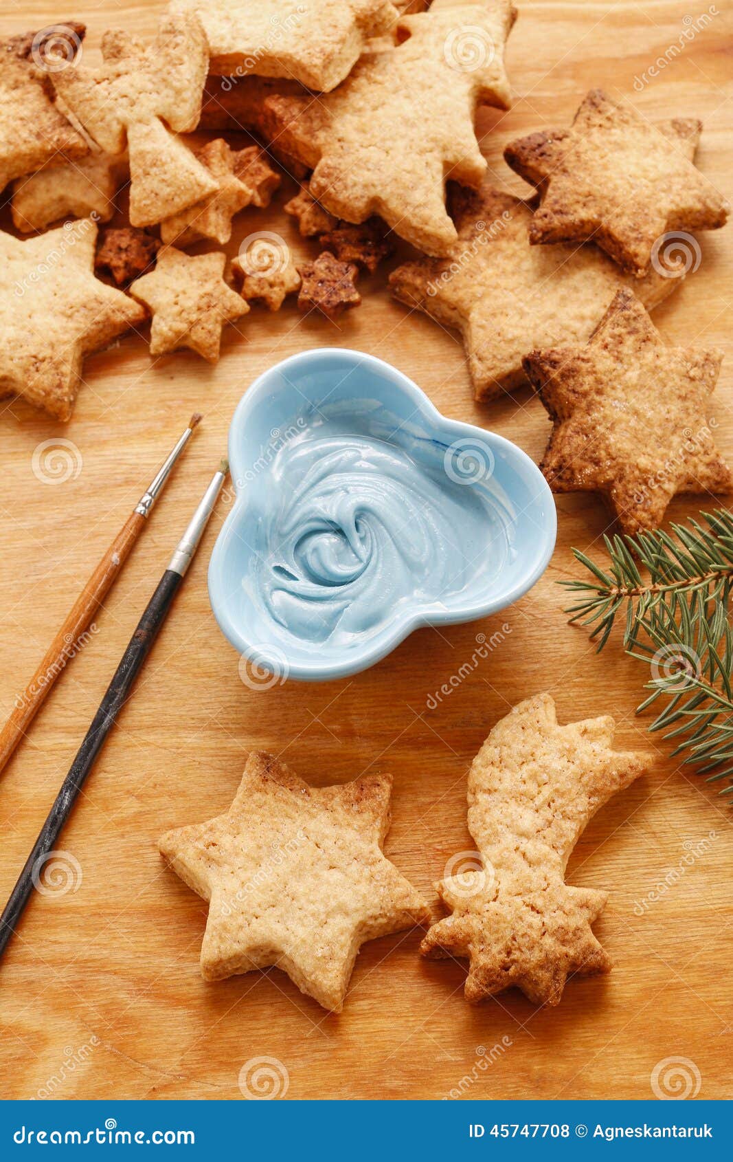 Decorating Gingerbread Cookies with Blue and White Icing. Stock Photo ...