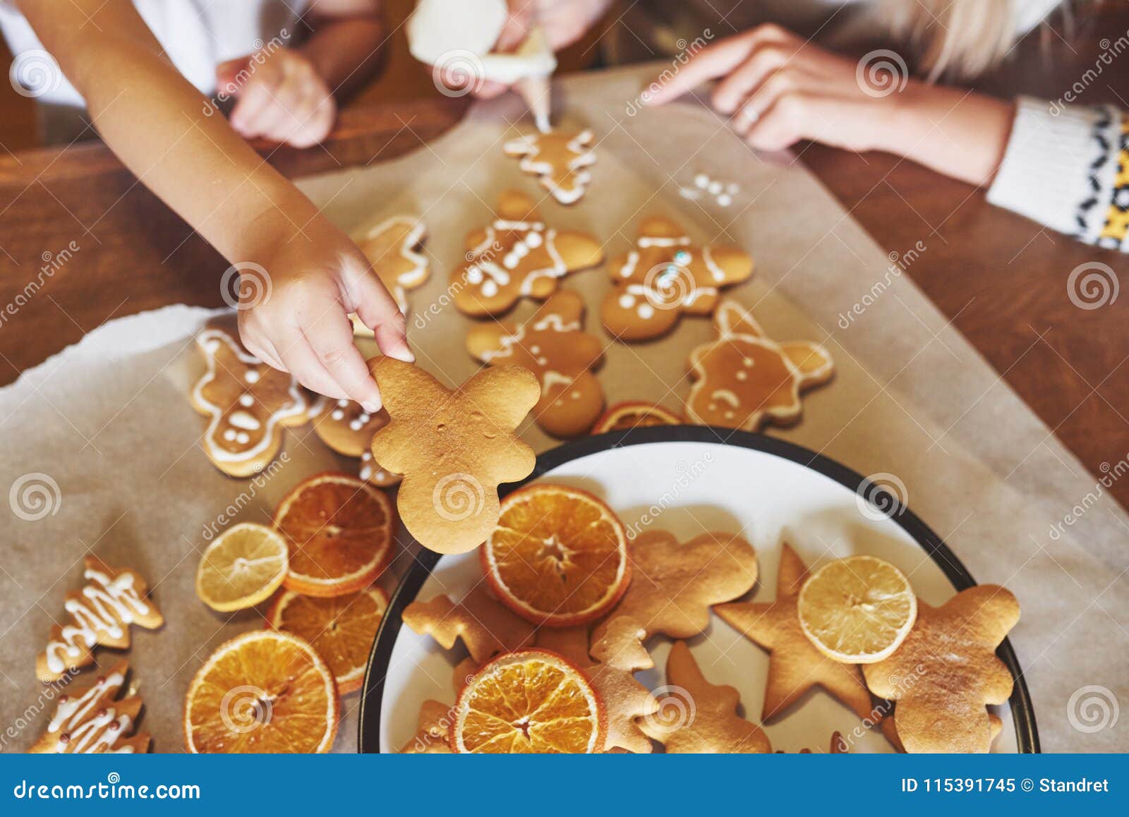 Decorating Gingerbread Cookies with White Icing, Selective Focus and ...