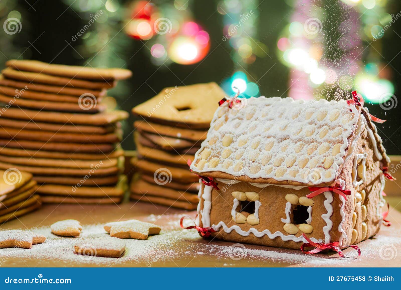 Decorating Gingerbread Cottage with Icing Sugar Stock Photo - Image of ...
