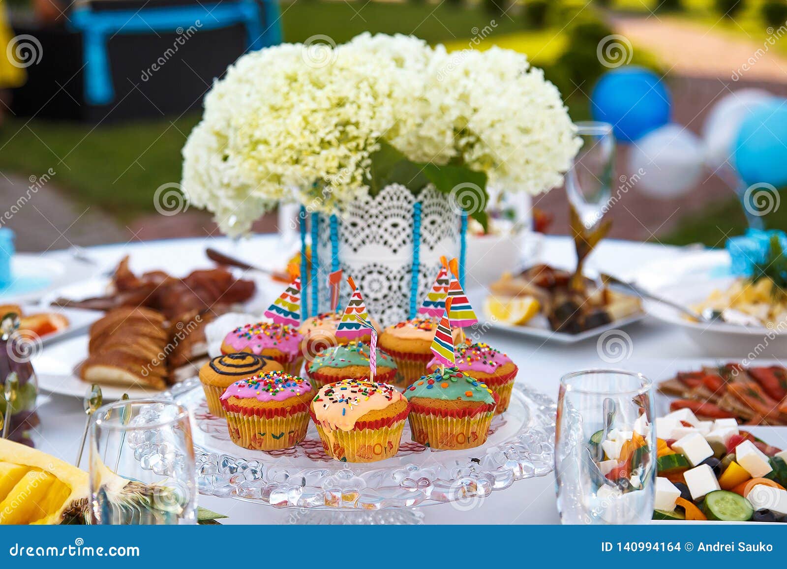 Decorating the Festive Table in Blue with Cupcakes Stock Photo - Image ...