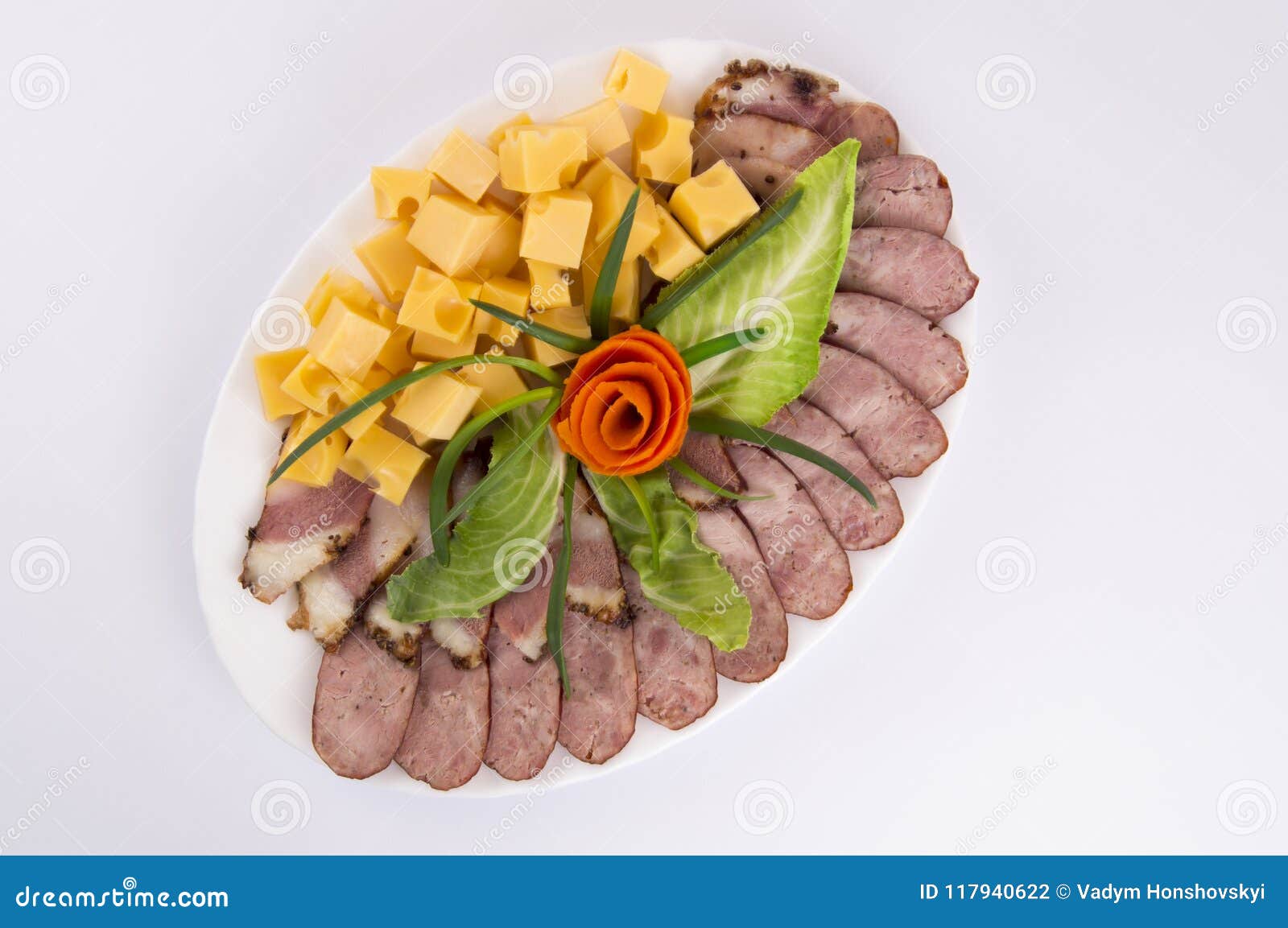 Decorating Meat Dishes with Cheese on a Light Background Stock Photo ...