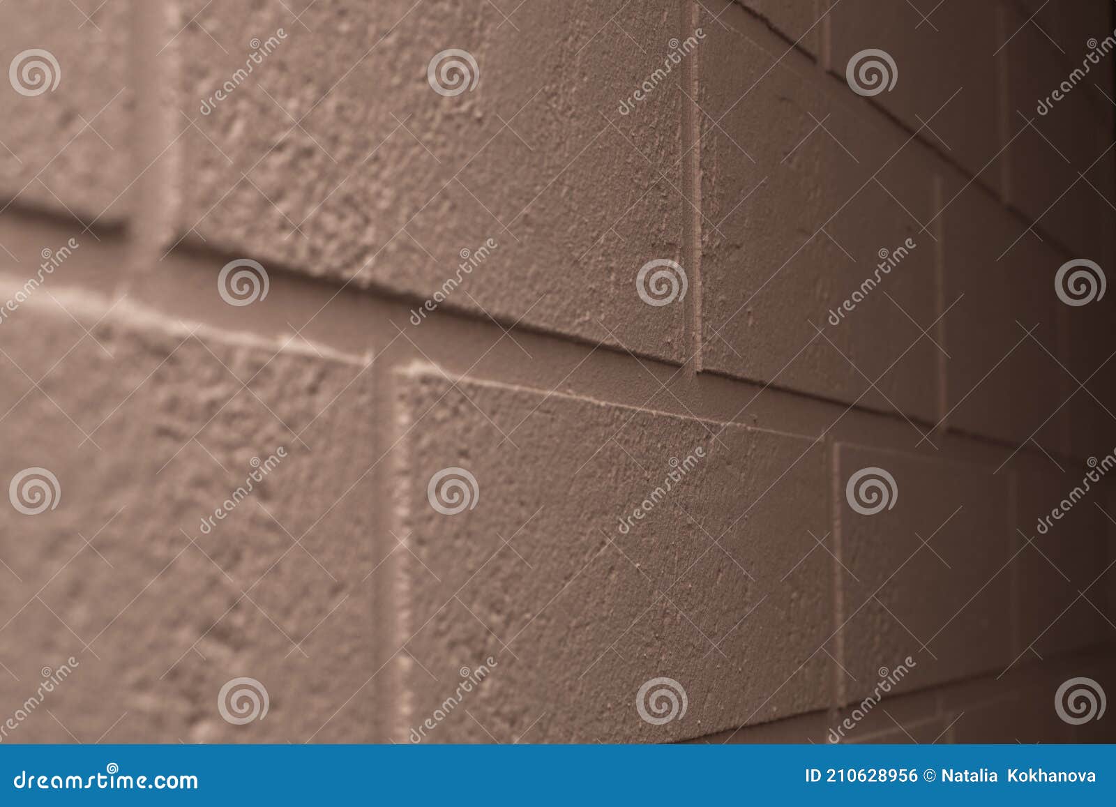 Decorating the Wall with Brick-shaped Plaster. Beige Wall, Selective ...