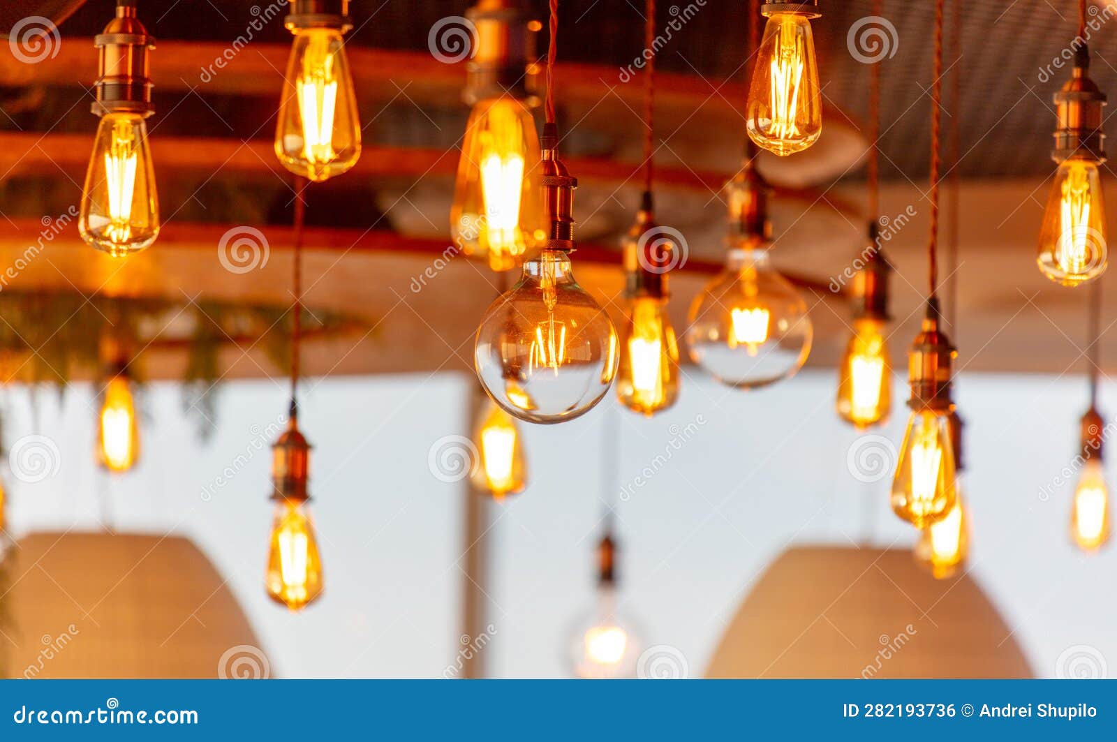 Decorative Antique Edison Style Filament Light Bulbs Hanging from ...