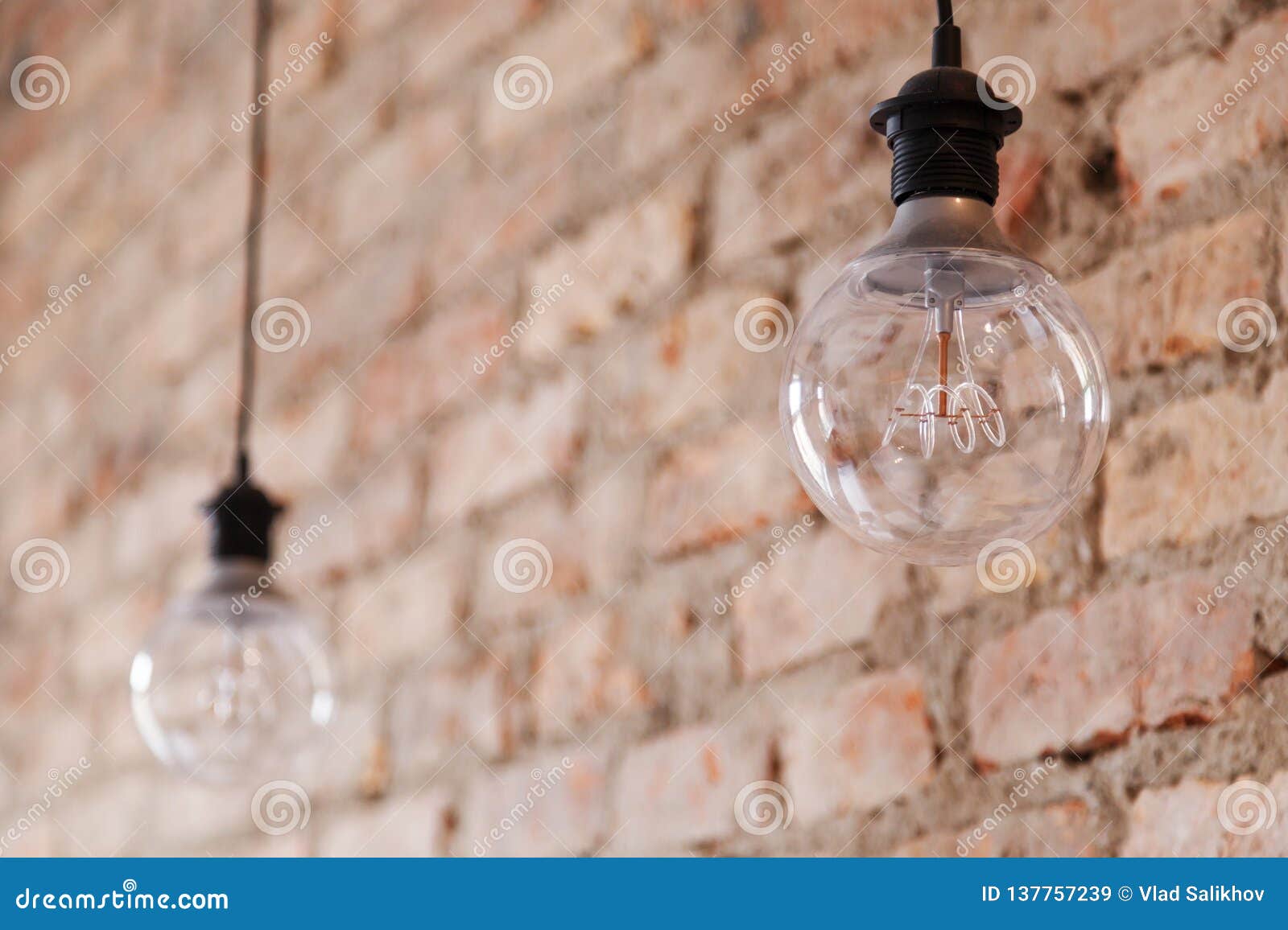 Decorative Antique Edison Style Light Bulbs Against Brick Wall ...