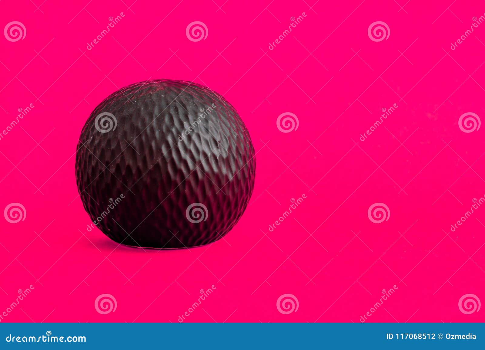 Decorative Black Sphere with Irregular Spiral Pattern on Pink Stock ...