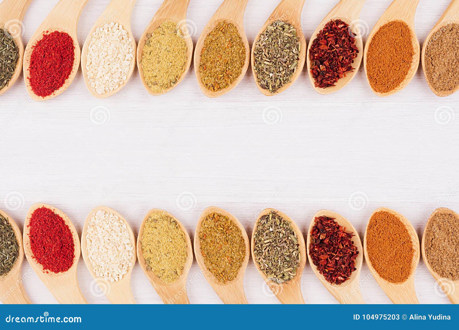 Decorative Border of Different Spices in Bamboo Spoons on White Wood ...