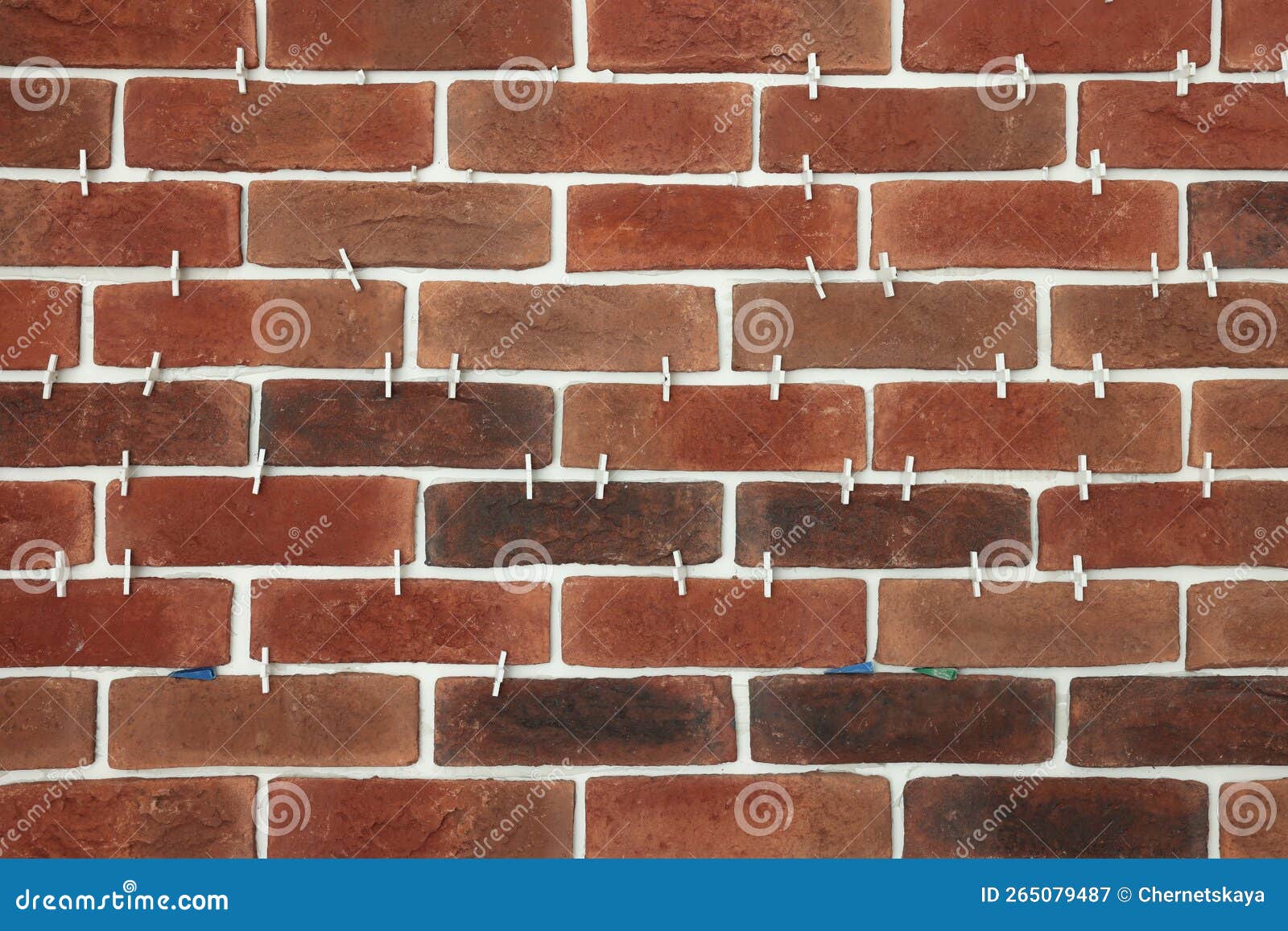 Decorative Bricks with Tile Leveling System on Wall Stock Image - Image ...