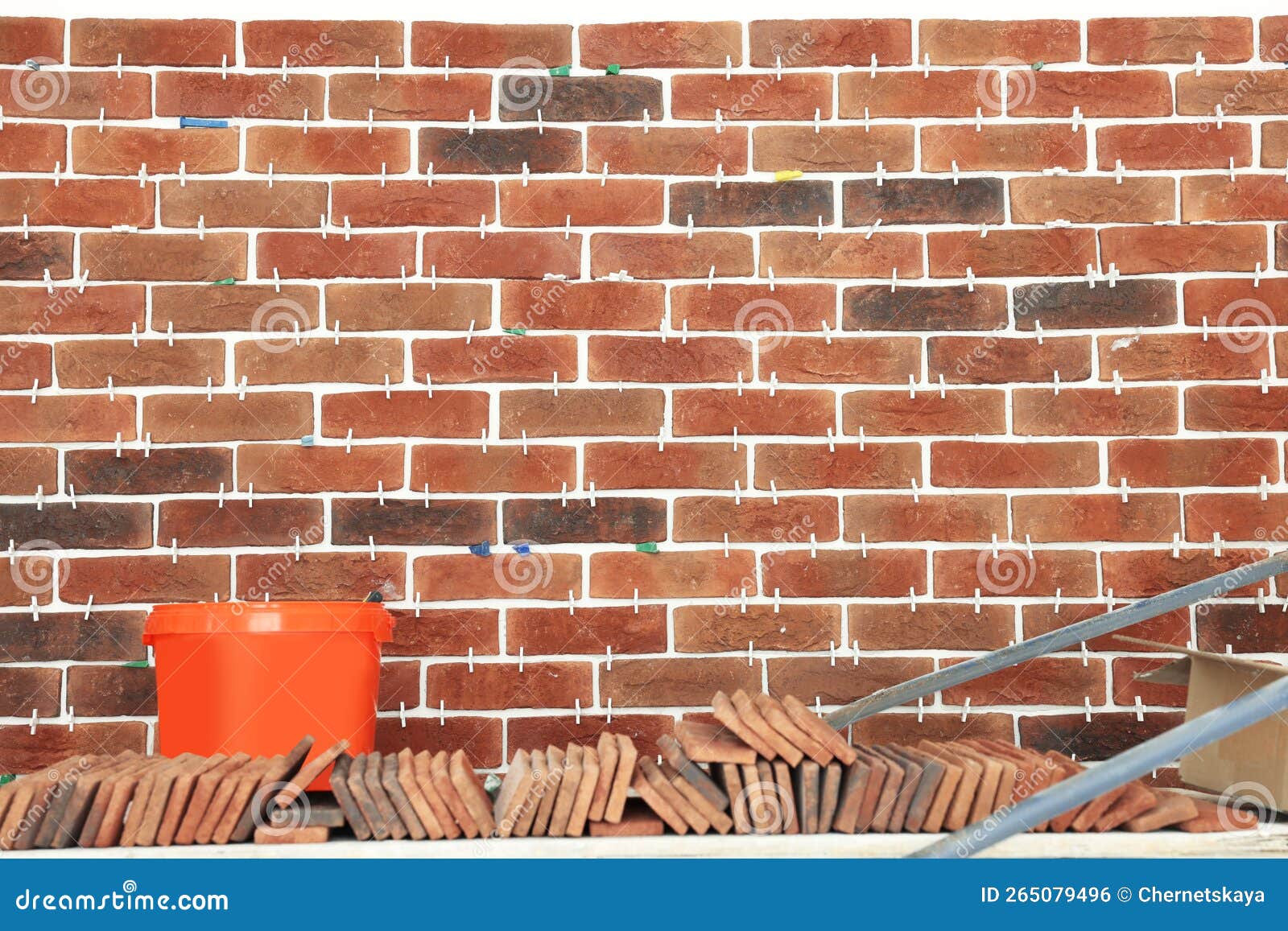 Decorative Bricks with Tile Leveling System on Wall Stock Photo - Image ...