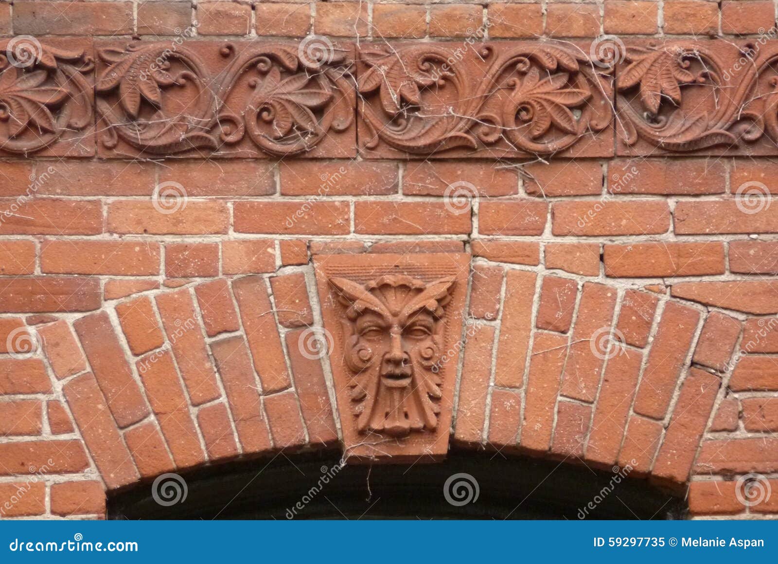 Decorative Brickwork with Face Stock Image - Image of curving, leaves ...