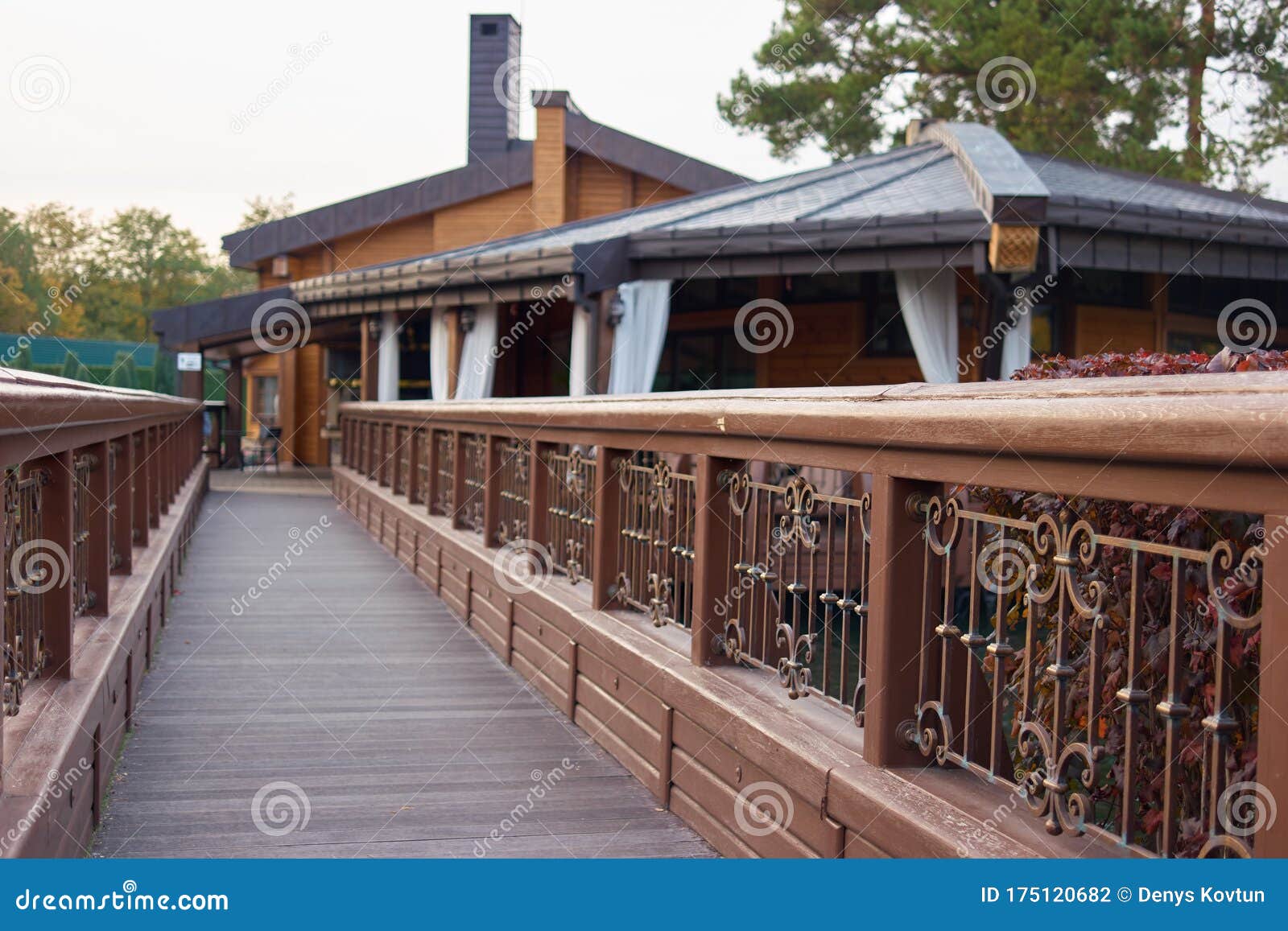 Decorative Brown Railing of a Bridge Leading To a Restaurant. Stock ...