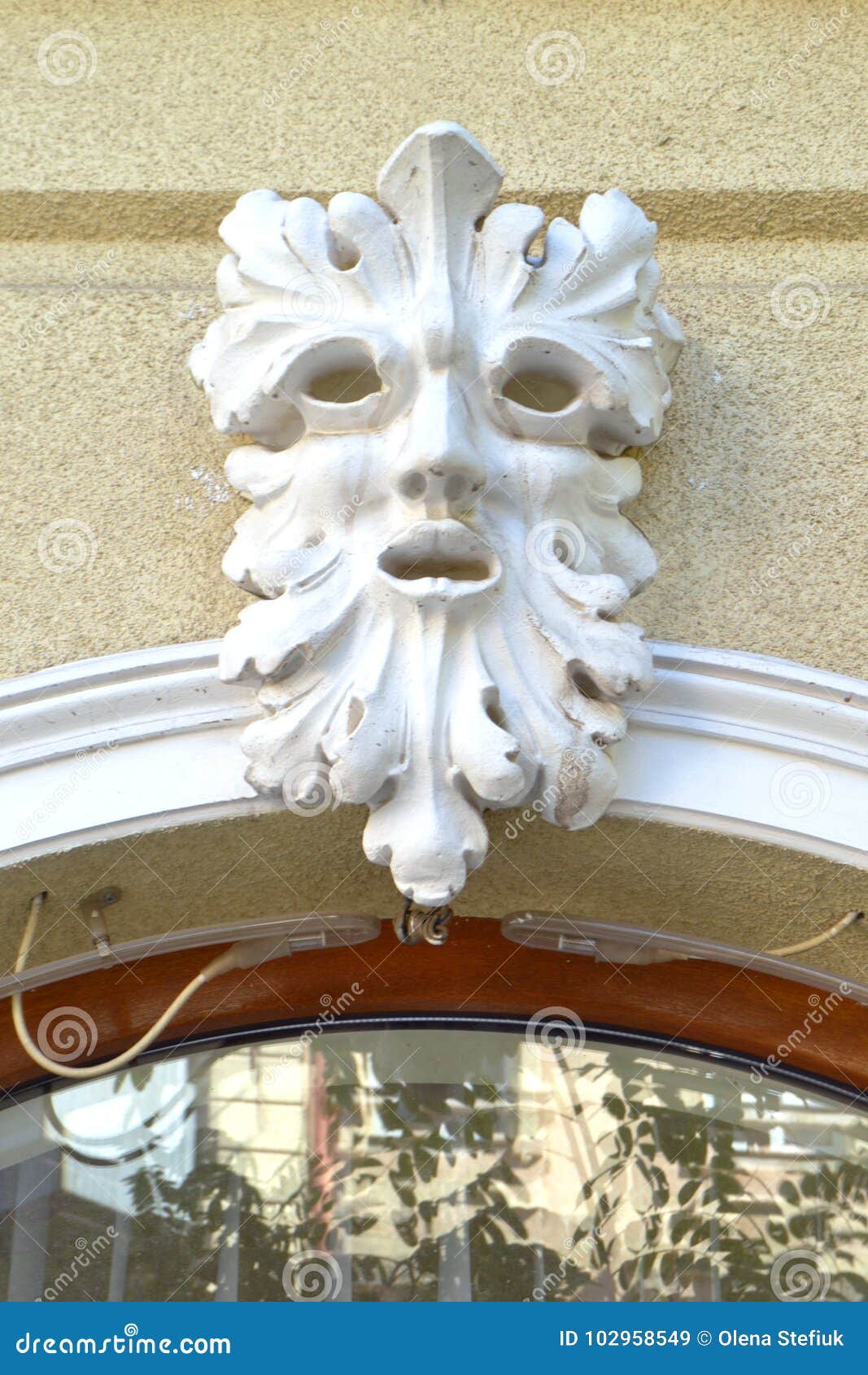 Decorative Carved Face on Building Facade Stock Image - Image of ...