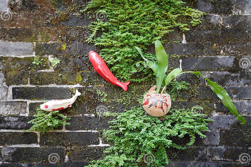 Decorative Ceramic Fish on a Brick Wall Stock Image - Image of brick ...