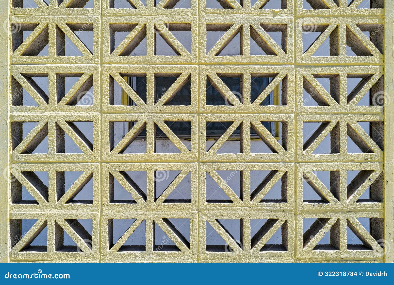 A Decorative Concrete Block Divider Wall with a Repeating Geometric ...