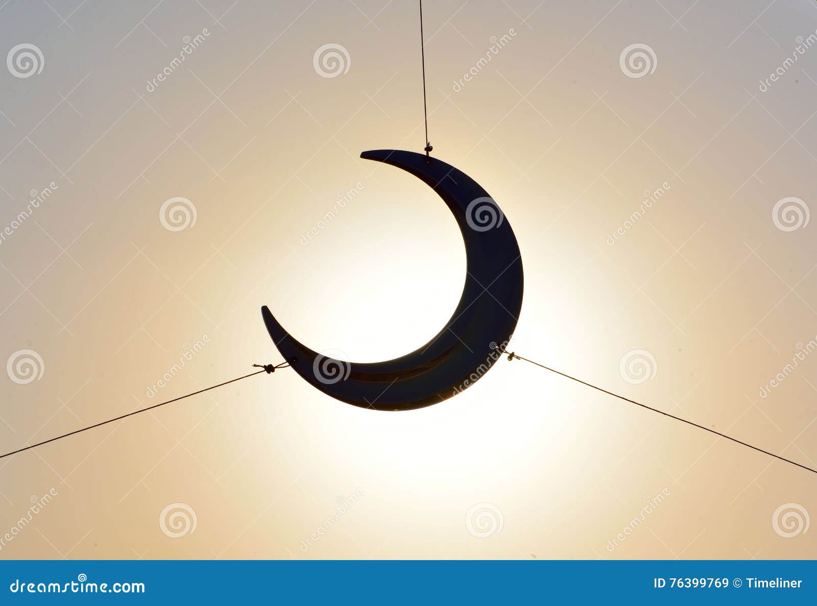 Decorative Crescent Moon Supported with Strings with Sun Besides Stock ...