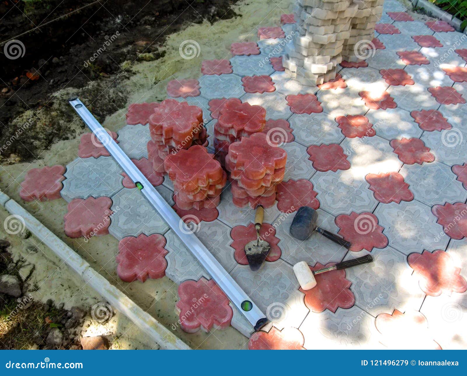 Decorative Figured Red-and-white Paving Tiles And Tools For Paving It ...