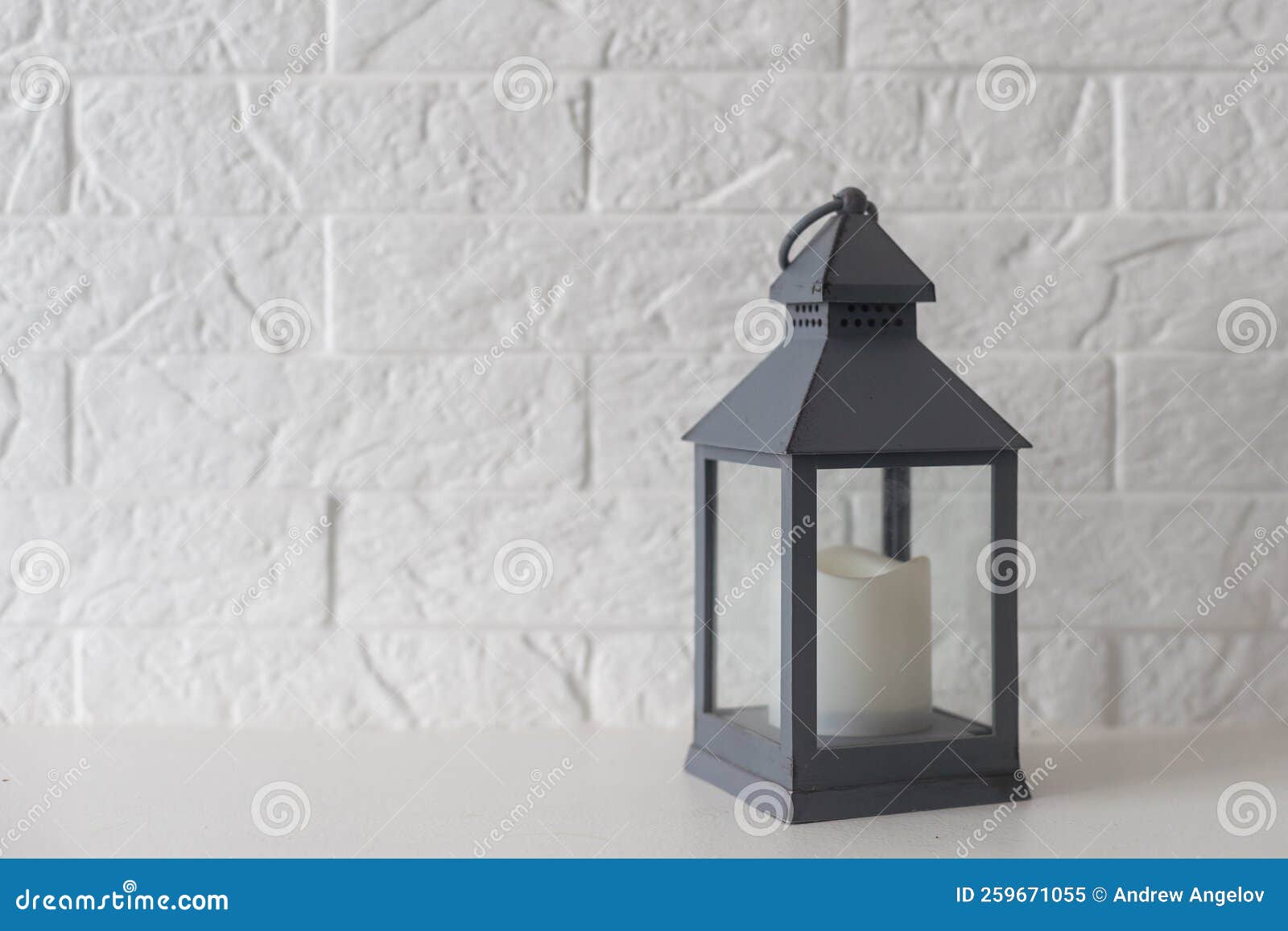 Decorative Flashlight Close-up on the Background of a White Brick Wall ...