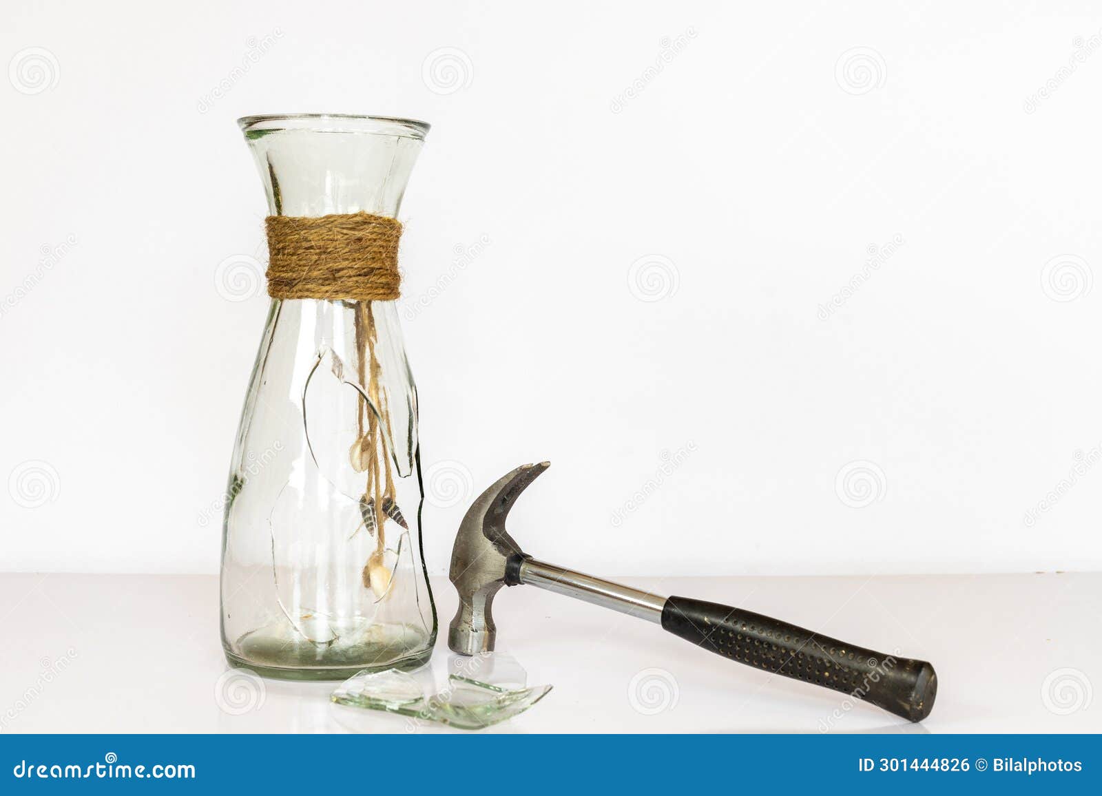 A Decorative Flower Vase Broken with a Hammer Isolated on White ...