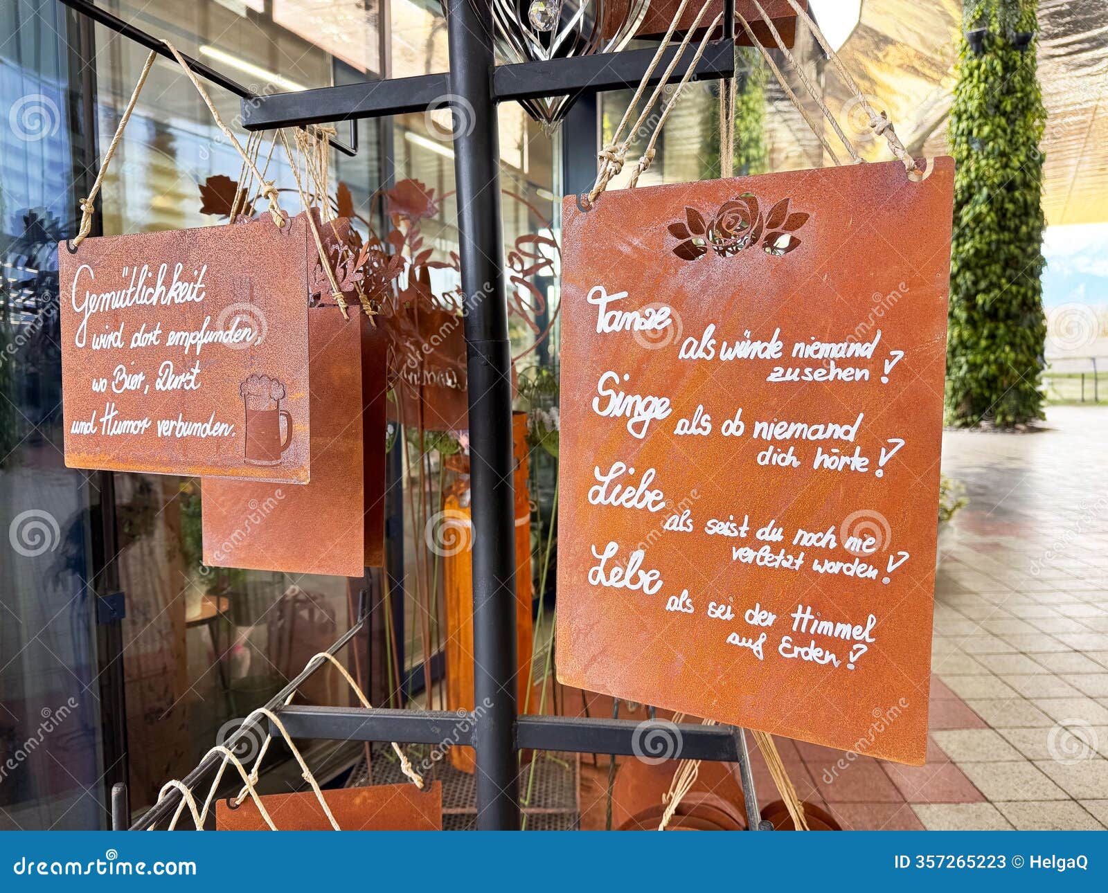 Decorative German Signs with Motivational Quotes in Outdoor Setting ...