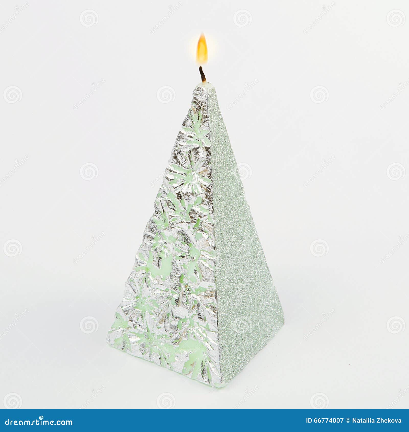 Decorative Handmade Candle in the Shape of a Pyramid on White Stock ...