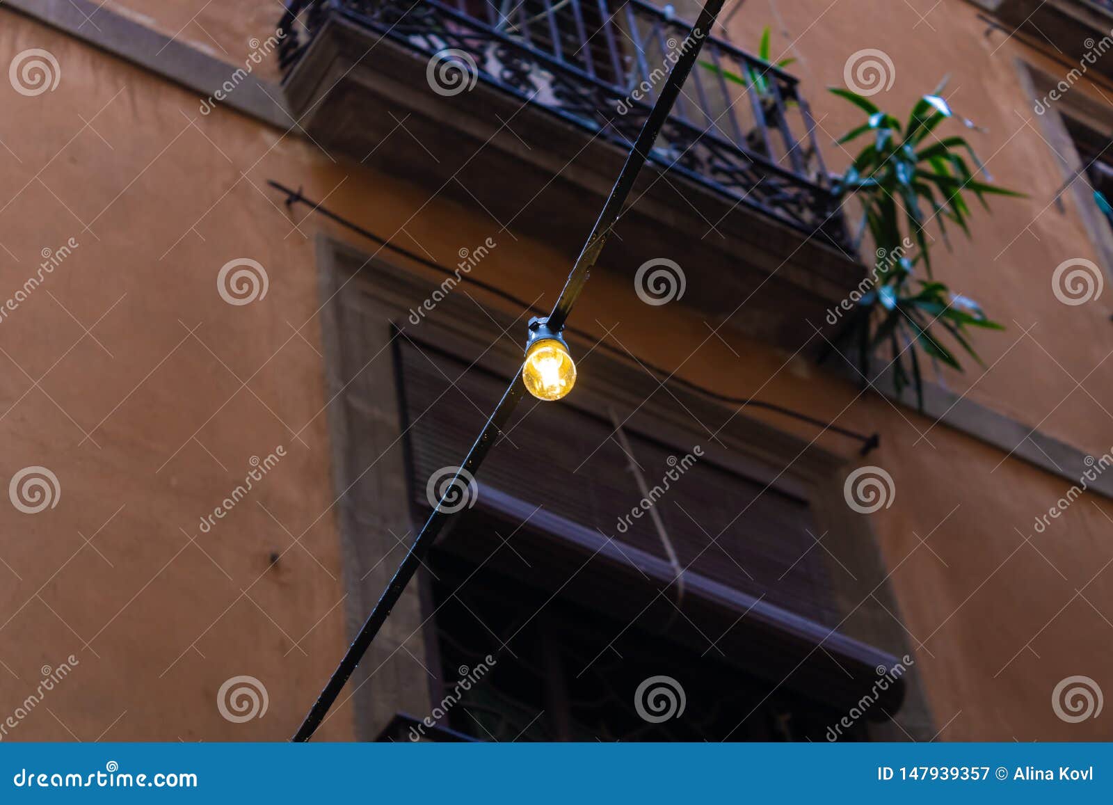 Decorative Light Bulb Hanging on String with the Window on the ...