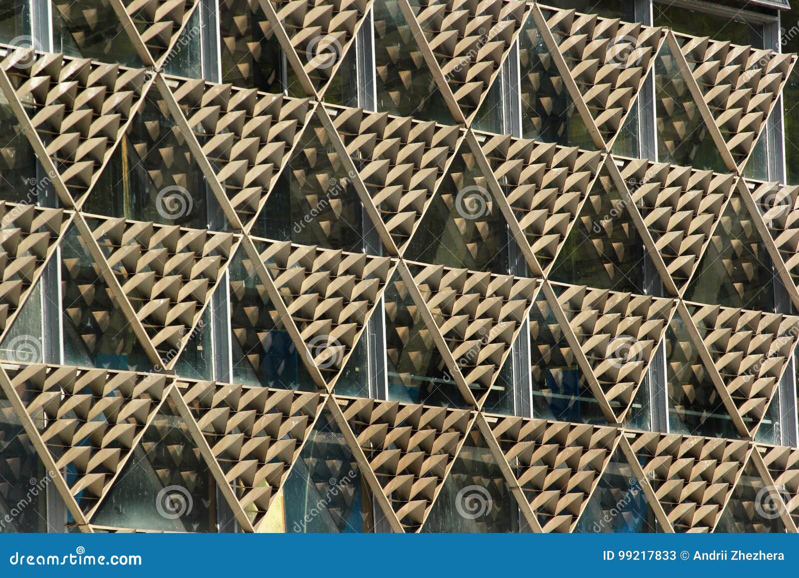 Decorative Metal Triangles on a Glass Wall Stock Image - Image of ...