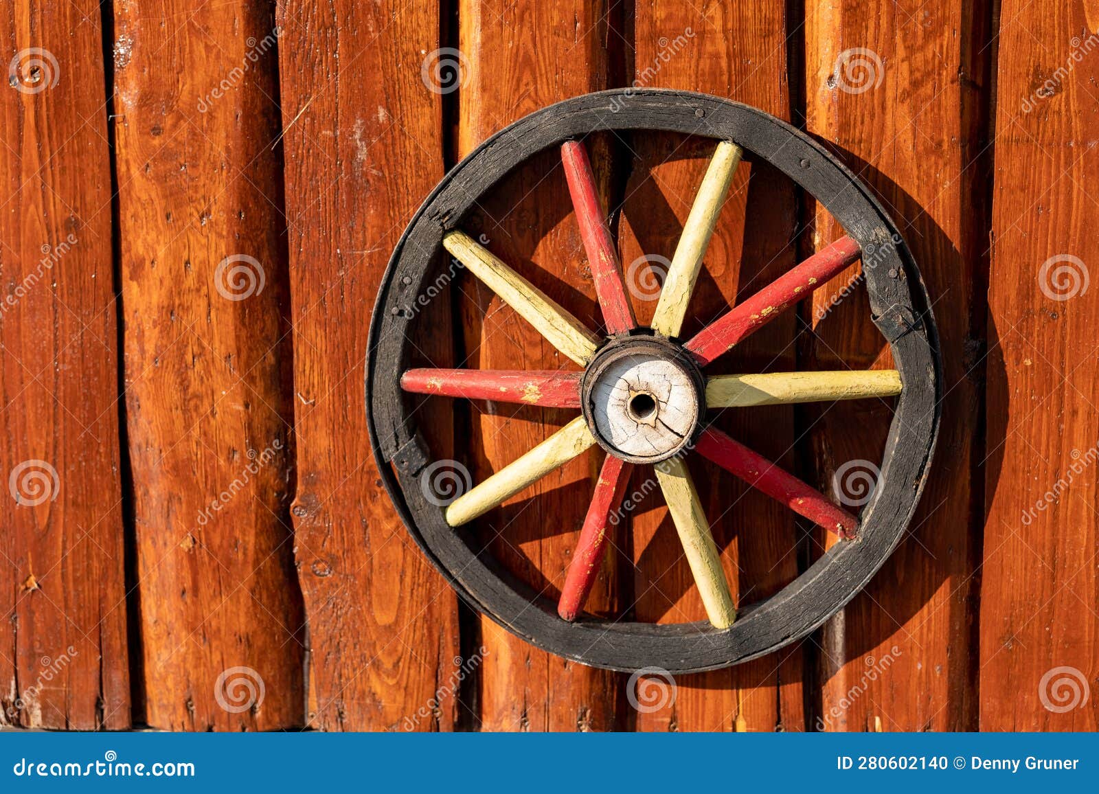 A Decorative Wooden Wheel on a Wall Stock Photo - Image of retro, round ...