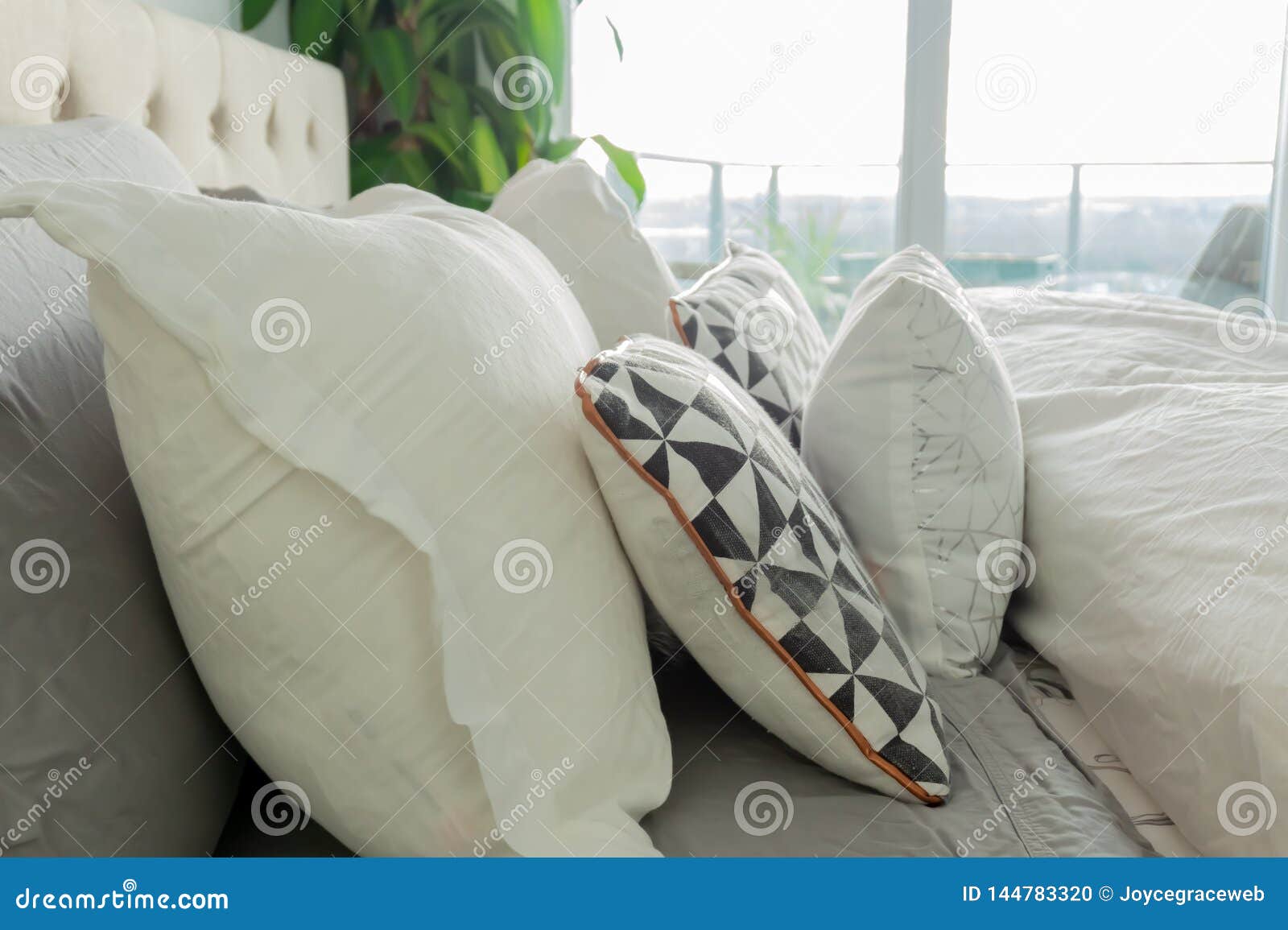 Decorative Pillows on a Real Bed, Inside an Authentic Home. White ...