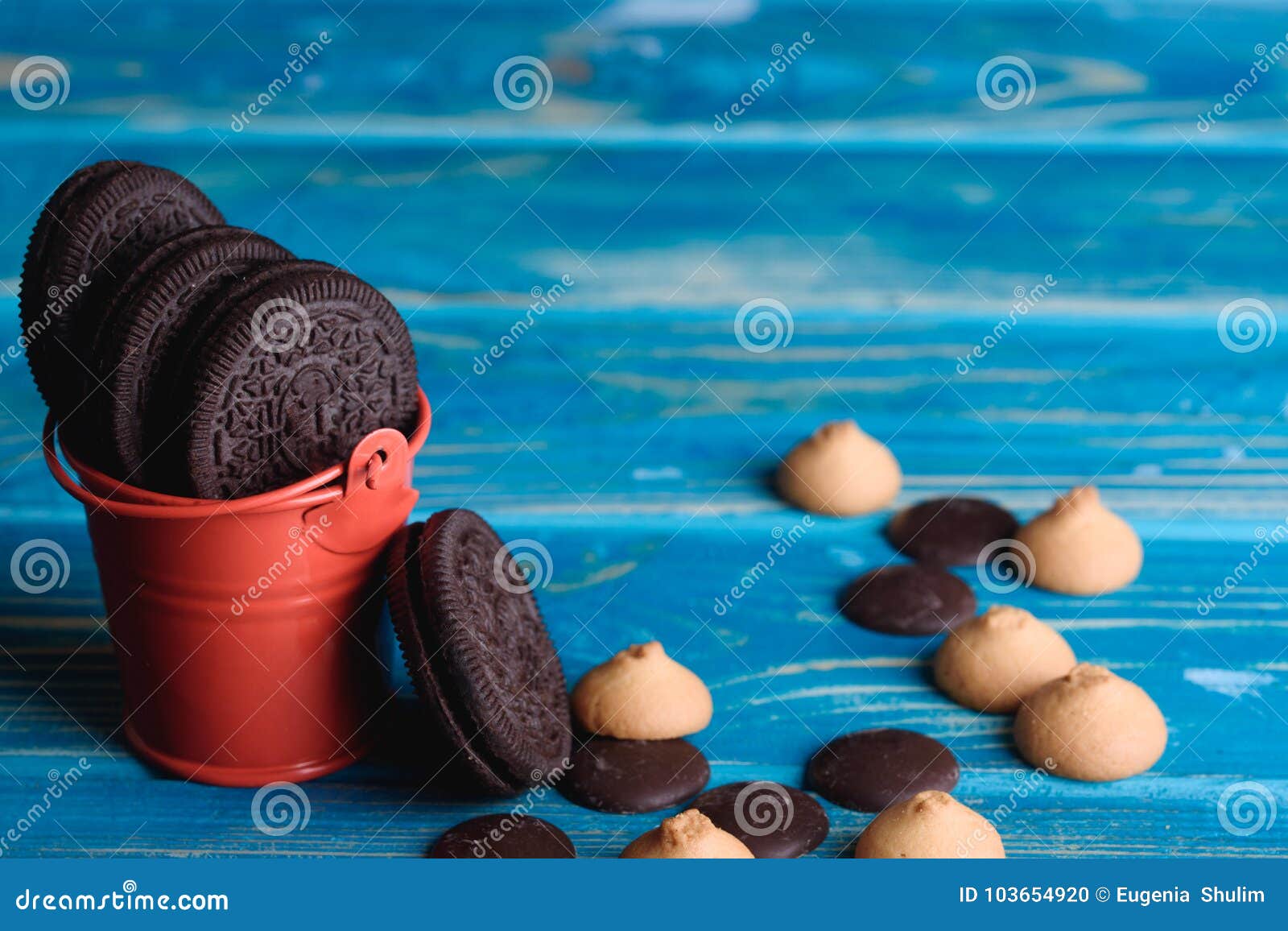 Decorative Red Pail with Chocolate Cookies on the Table Stock Photo ...