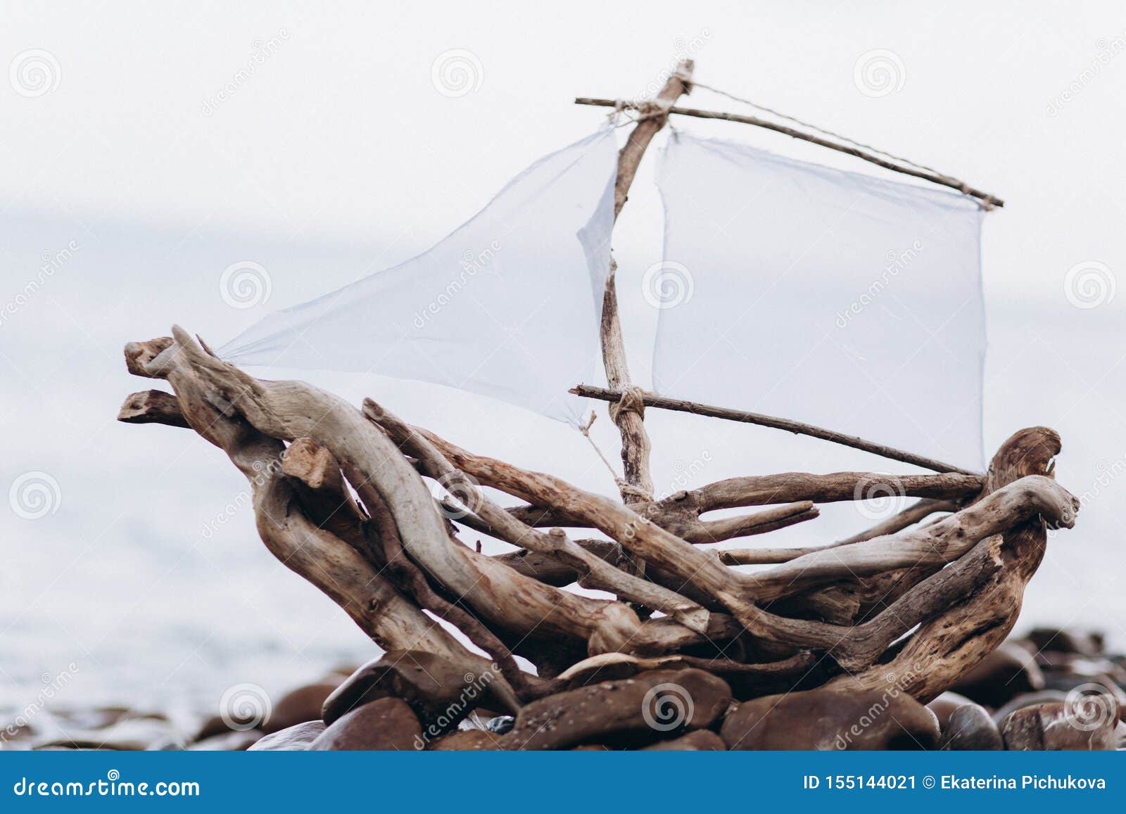 Decorative Ship Made of Branches and Roots with a Sail on the Seashore ...