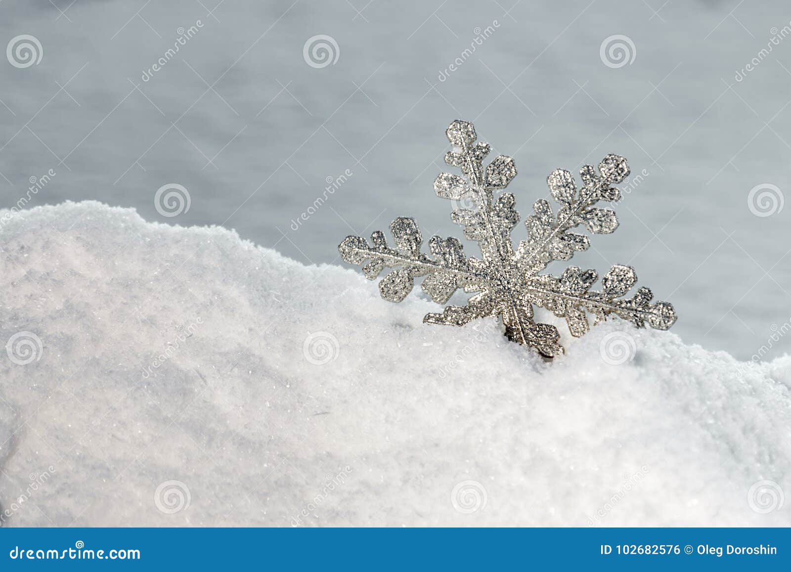 Decorative Snowflake Sticking Out of the Snow Stock Photo - Image of ...