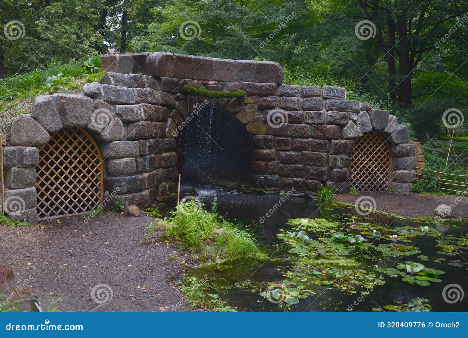 Decorative Stone Grotto and Pond in a Romantic Corner of the Garden ...