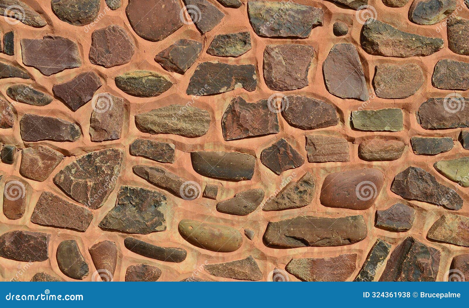 A Decorative Stone Wall in the Sunlight Stock Photo - Image of sunlight ...