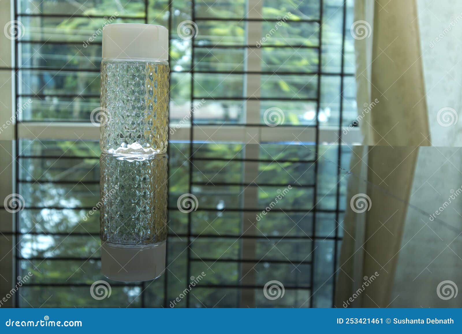 A Decorative Water Bottle on the Table Stock Image - Image of glasses ...