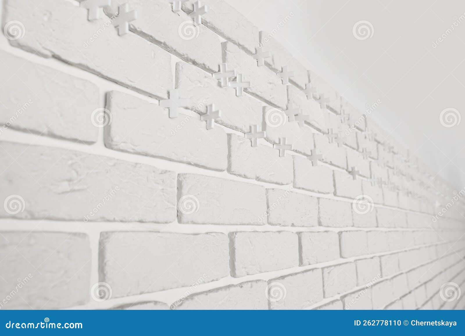 Decorative White Bricks with Tile Leveling System on Wall Stock Photo ...