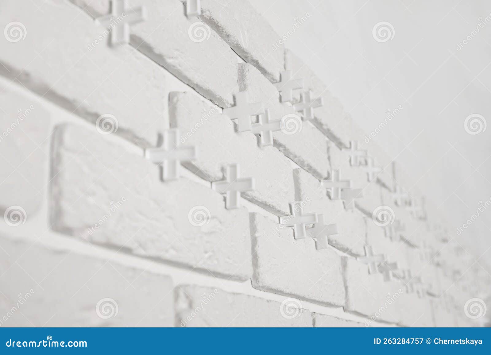 Decorative White Bricks with Tile Leveling System on Wall Stock Image ...