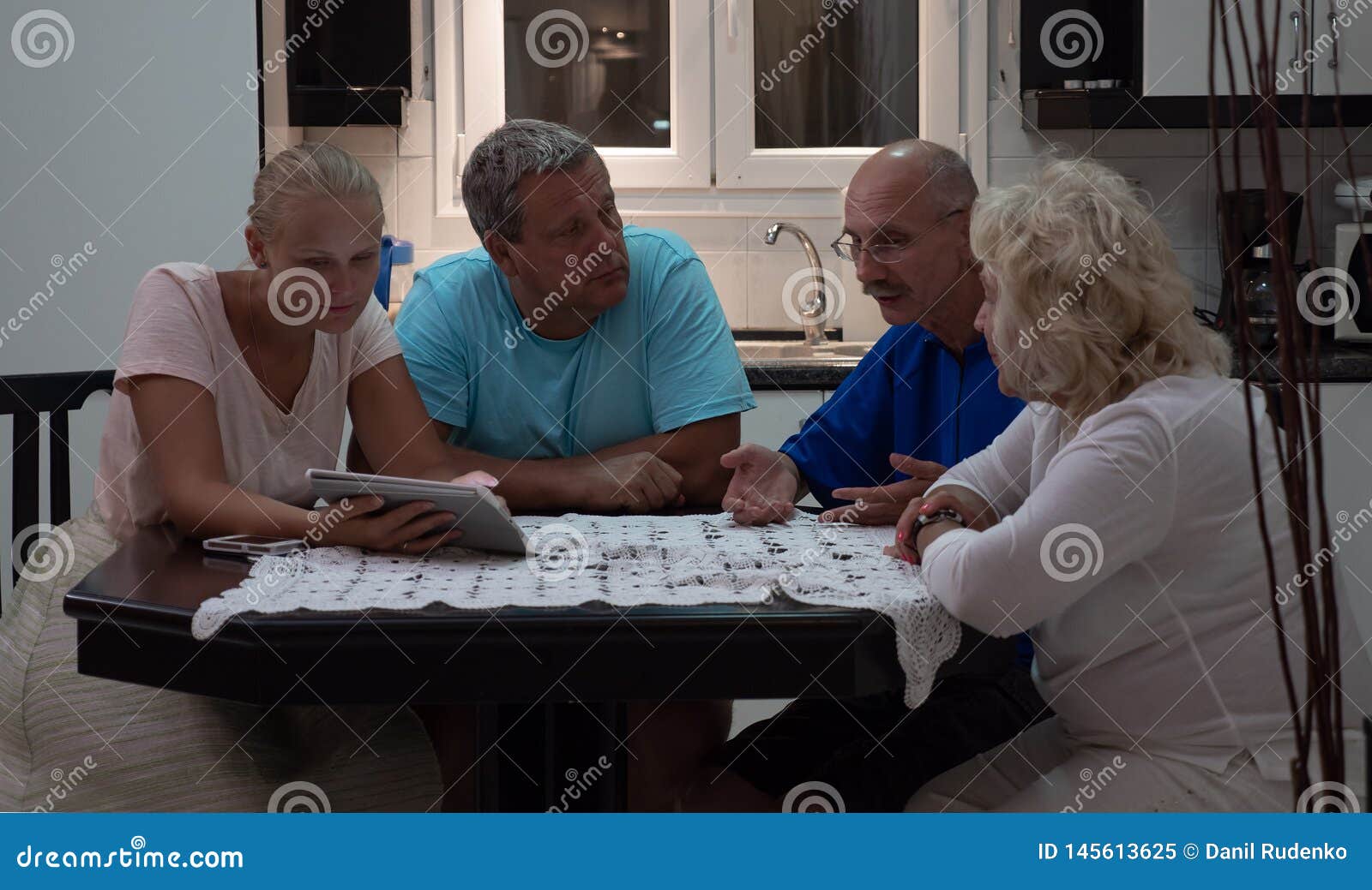 A decorous evening stock image. Image of sitting, kitchen - 145613625
