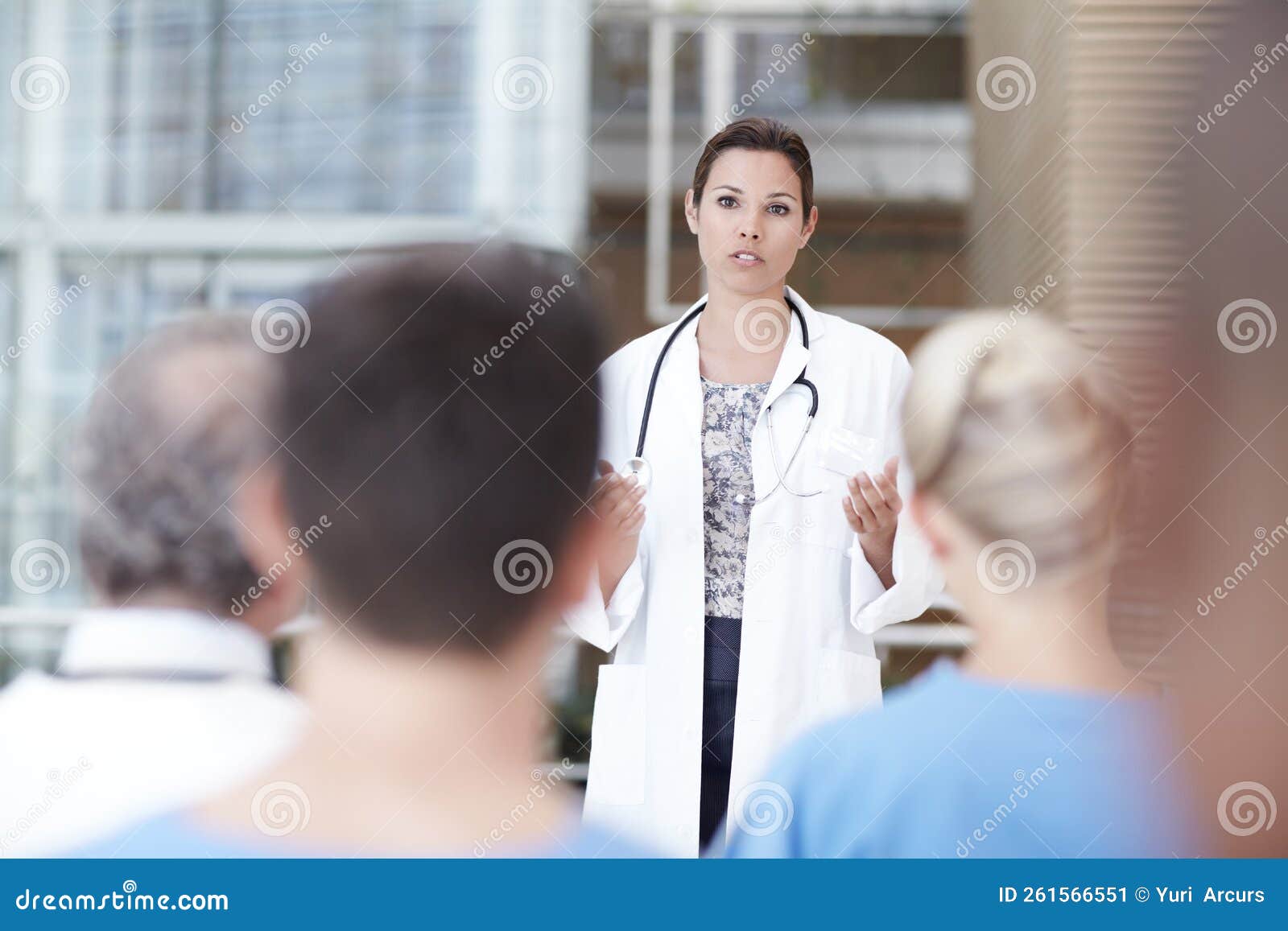 Dedicated Doctor. a Doctor Delivering a Speech in Front of Some ...