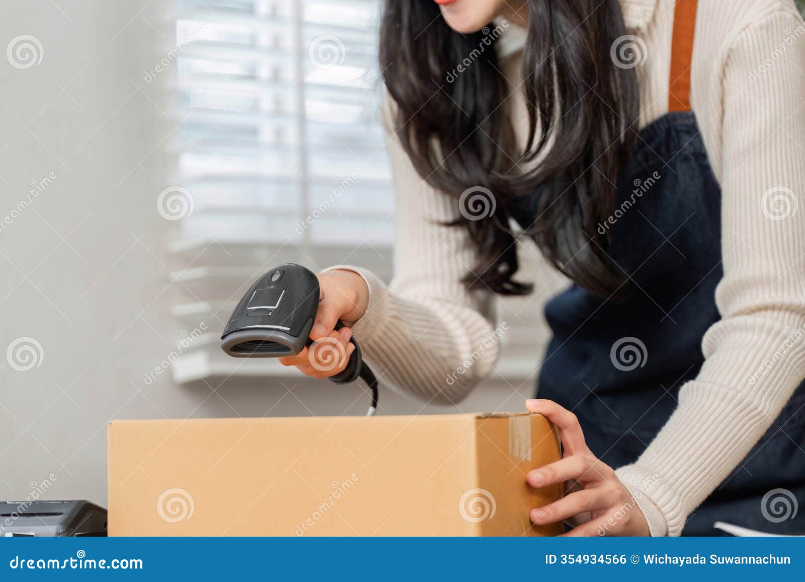 Woman Utilizing a Barcode Scanner To Efficiently Deliver Merchandise in ...
