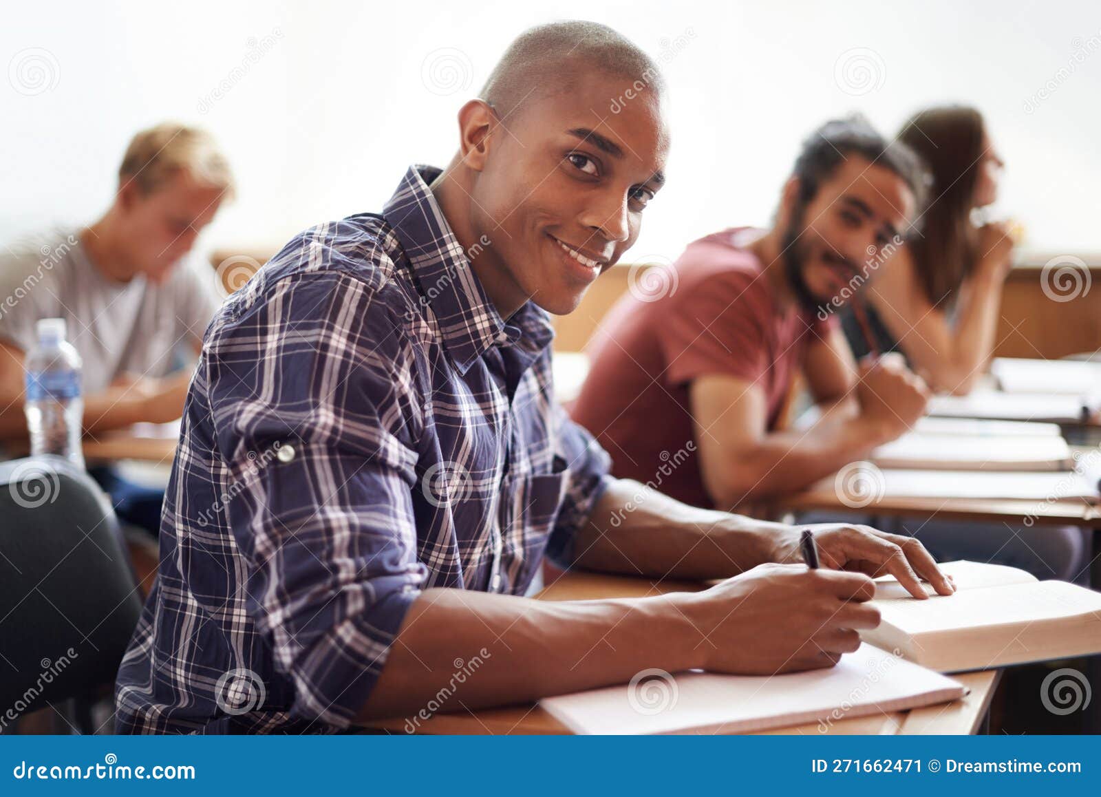 Dedicated To Education. a Young College Students in Class. Stock Image ...