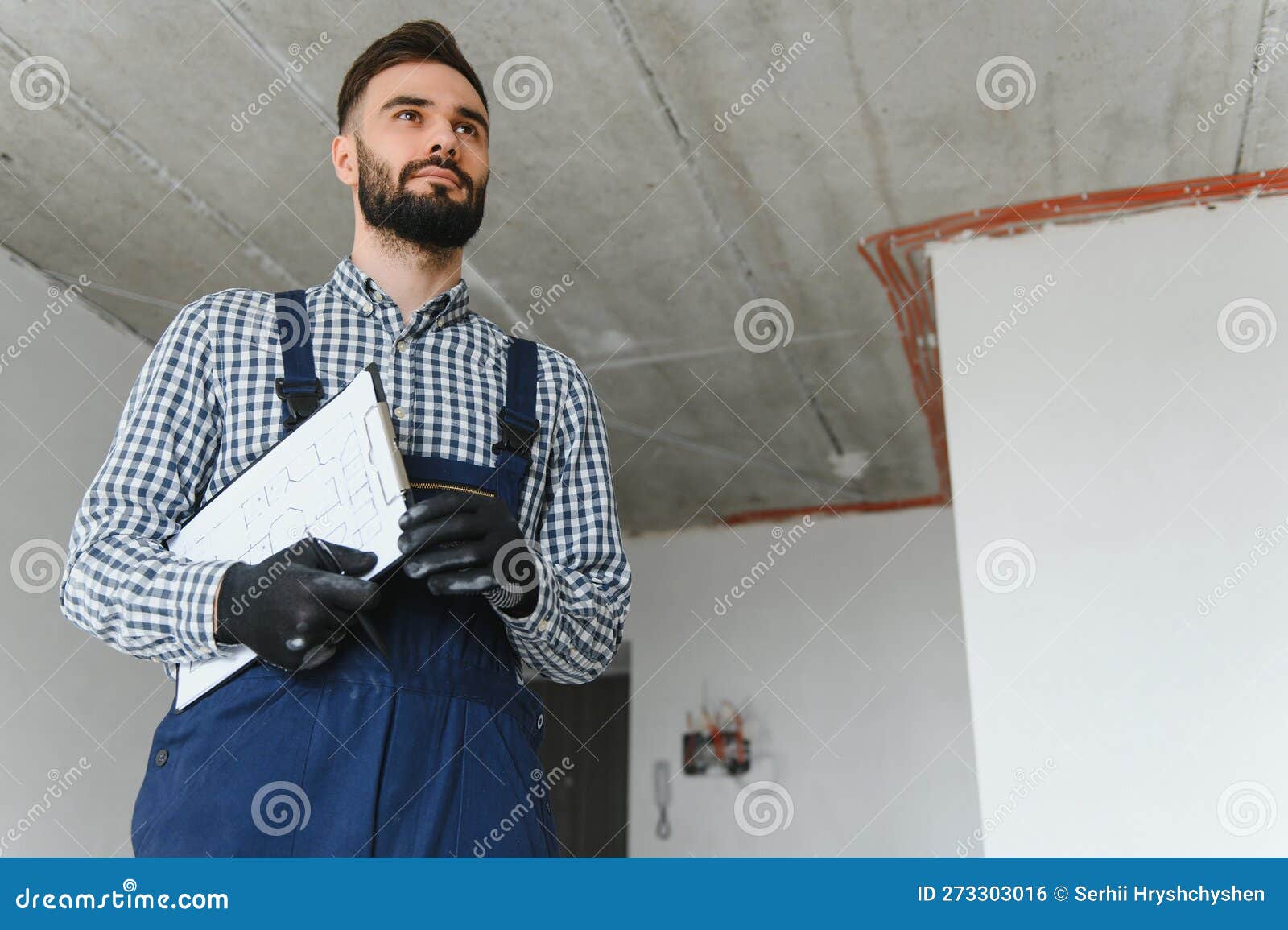 A Dedicated Worker Doing Calculations for Material for Apartment in ...