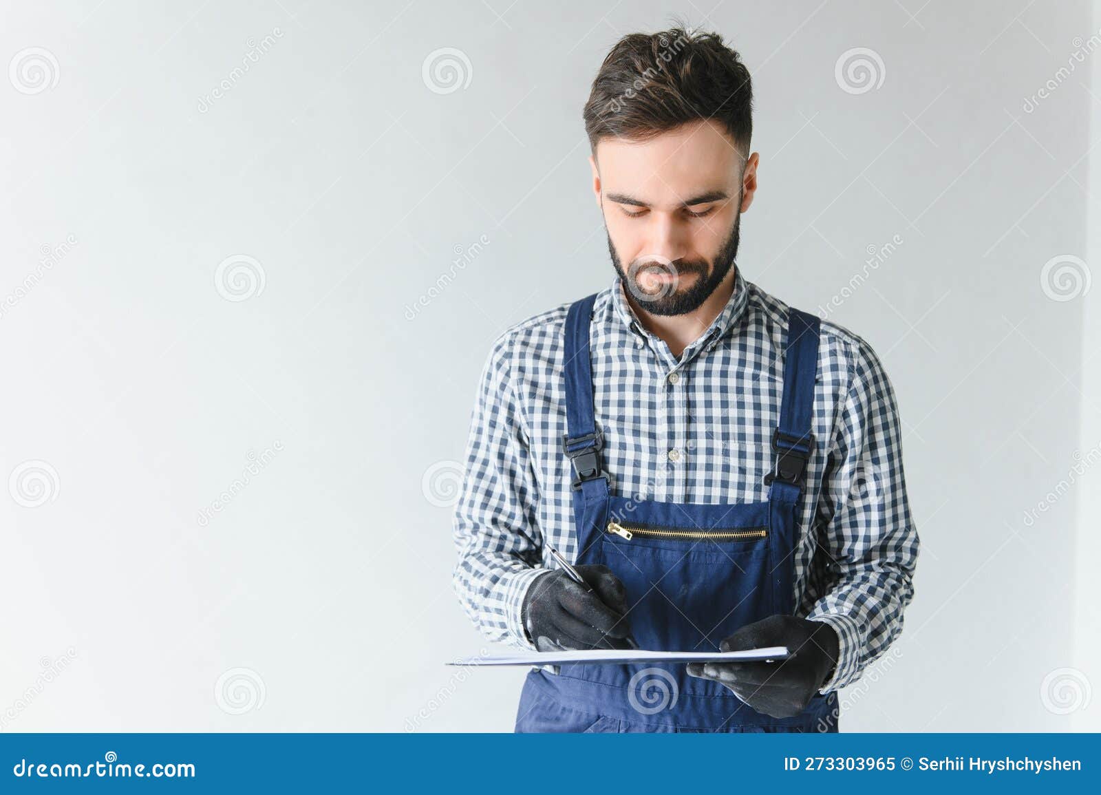 A Dedicated Worker Doing Calculations for Material for Apartment in ...