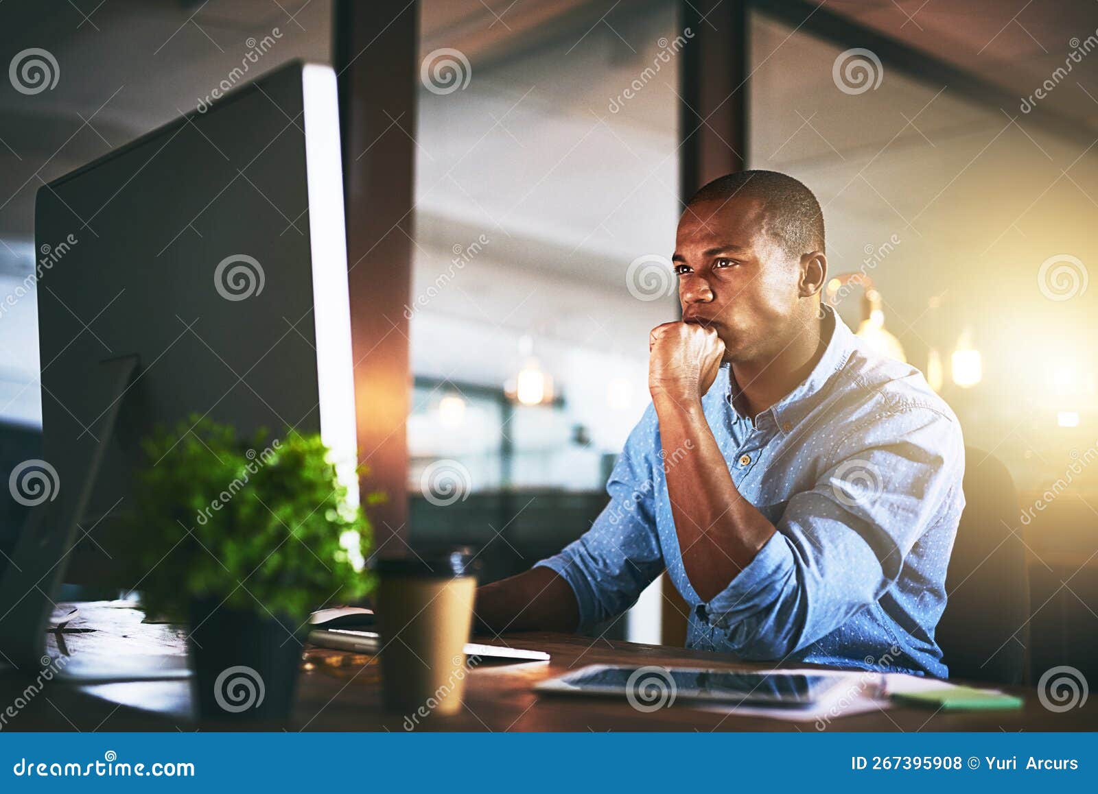 Dedication Doesn T Have a Knock Off Time. a Young Businessman Using a ...