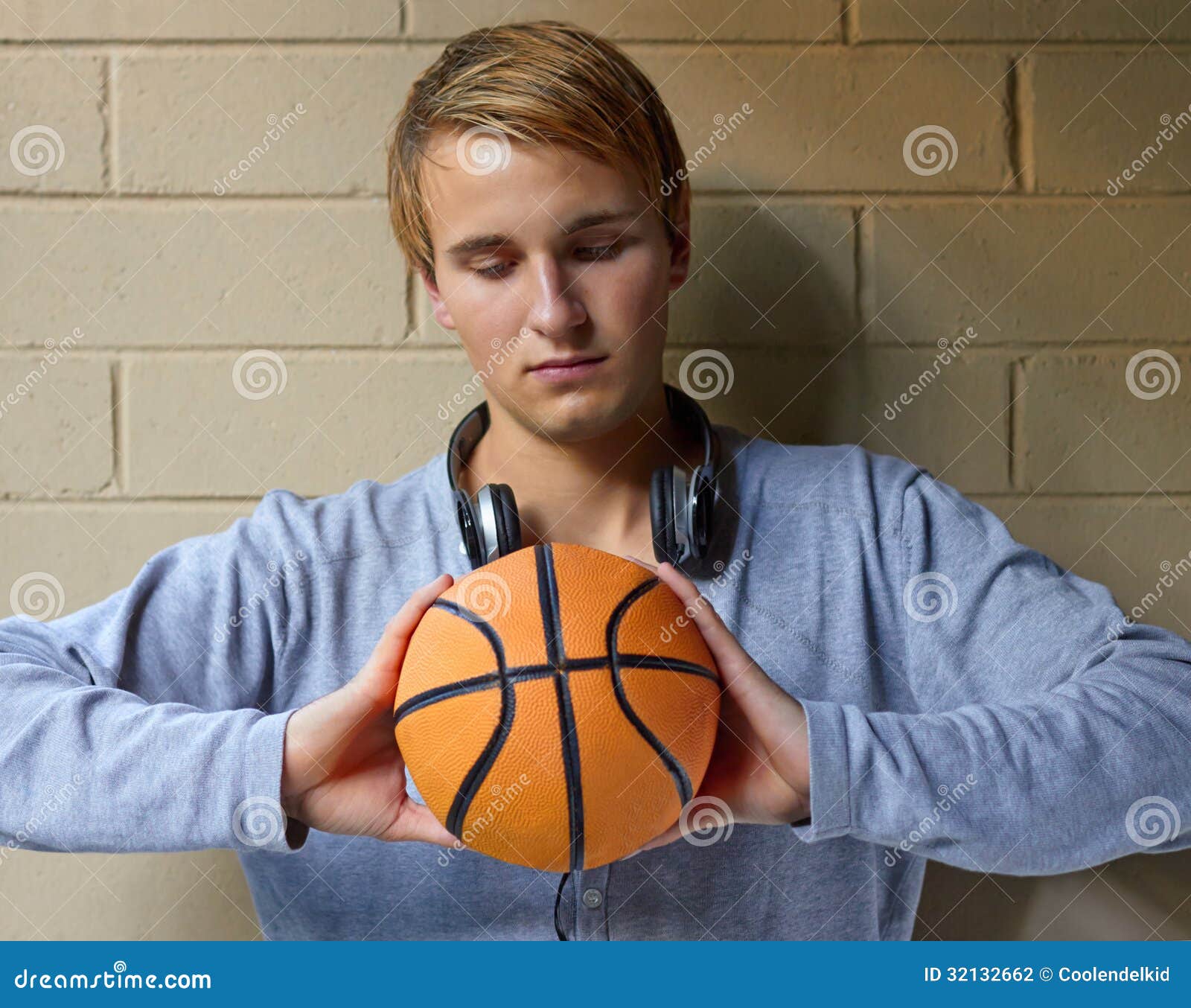 Deep in Basketball Thoughts Stock Photo - Image of handsome, looking ...